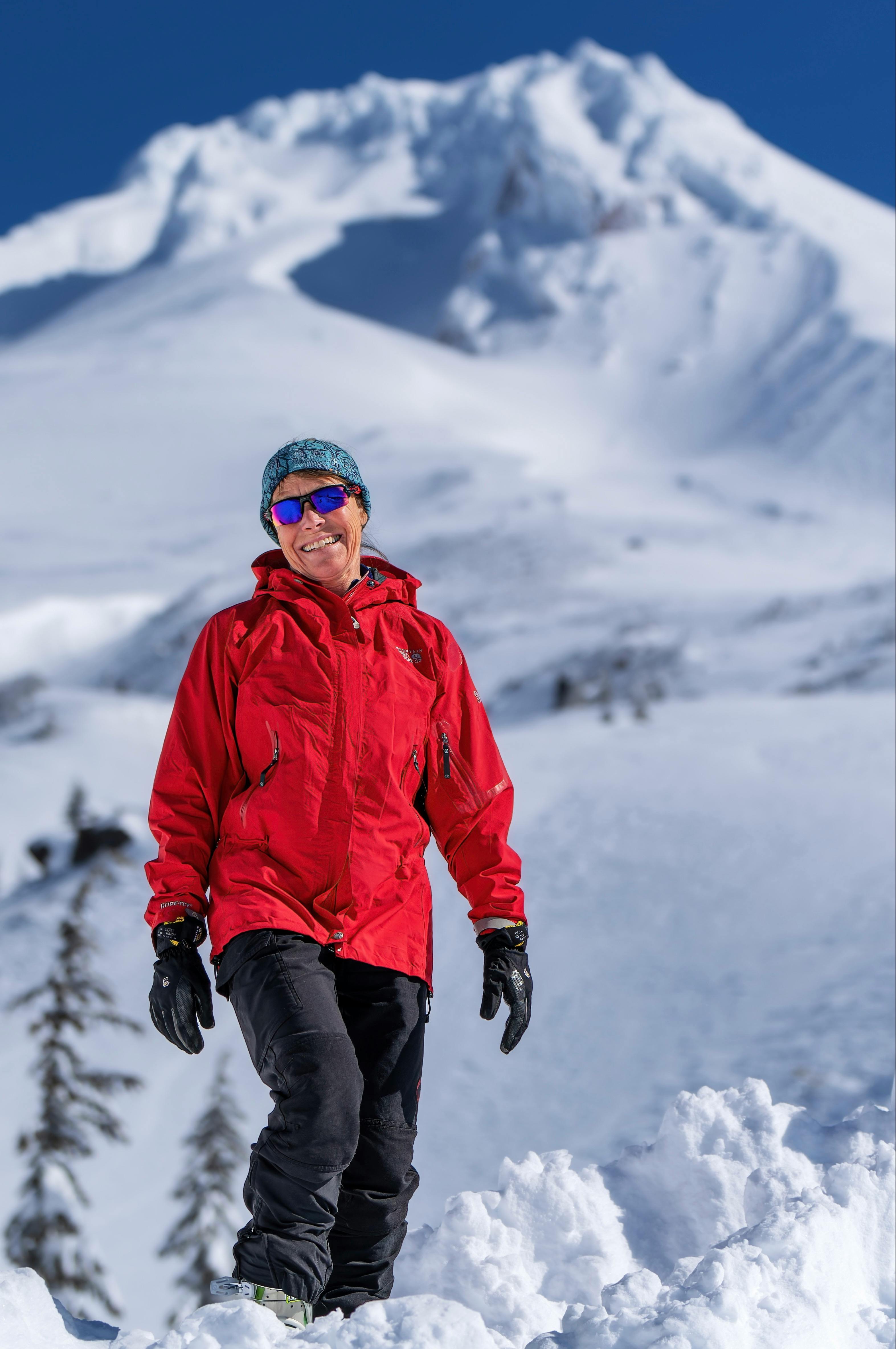 Smiling Woman Hiking in Red Jacket in Mountains · Free Stock Photo