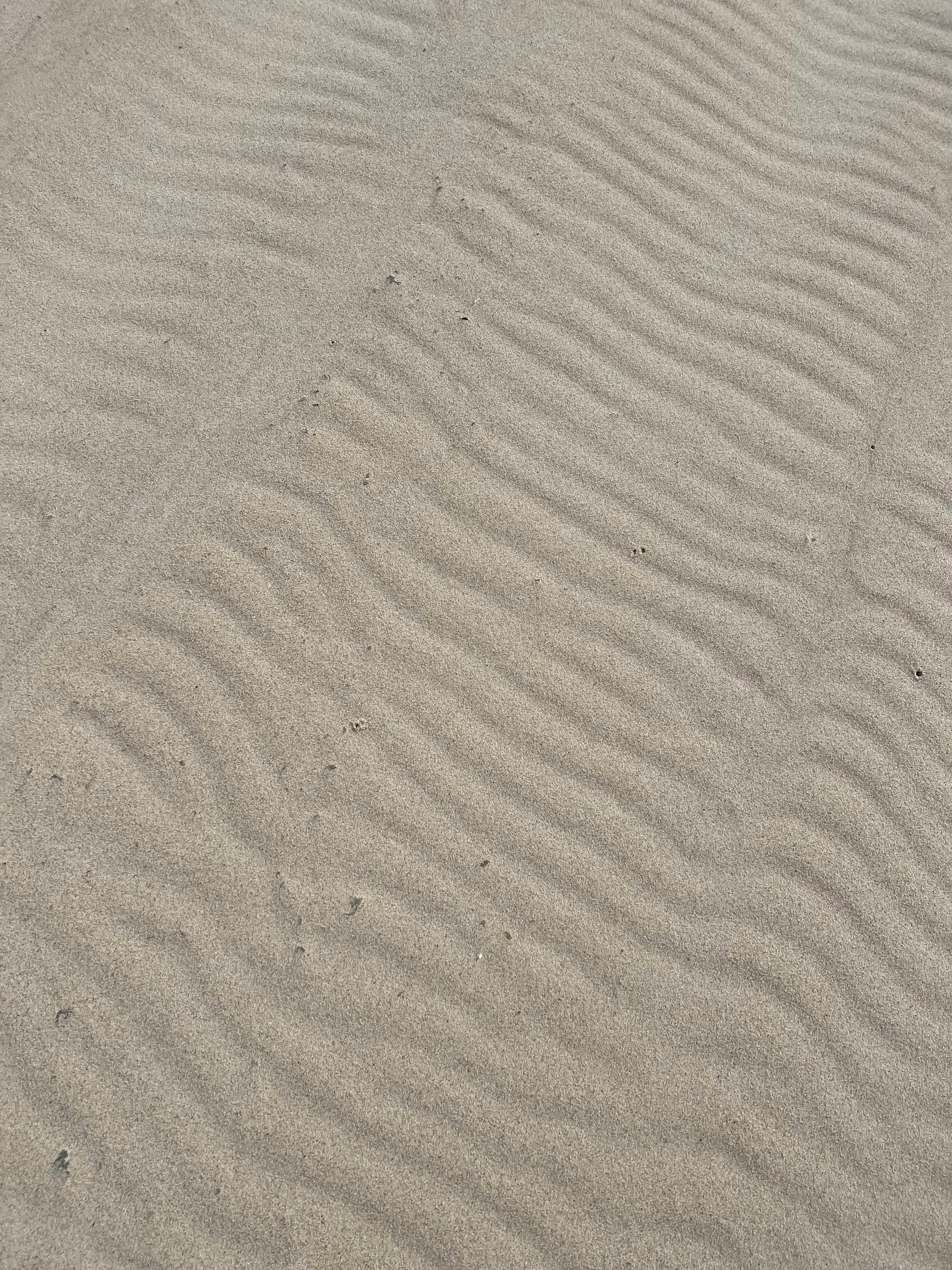 A close up of sand ripples on the beach · Free Stock Photo