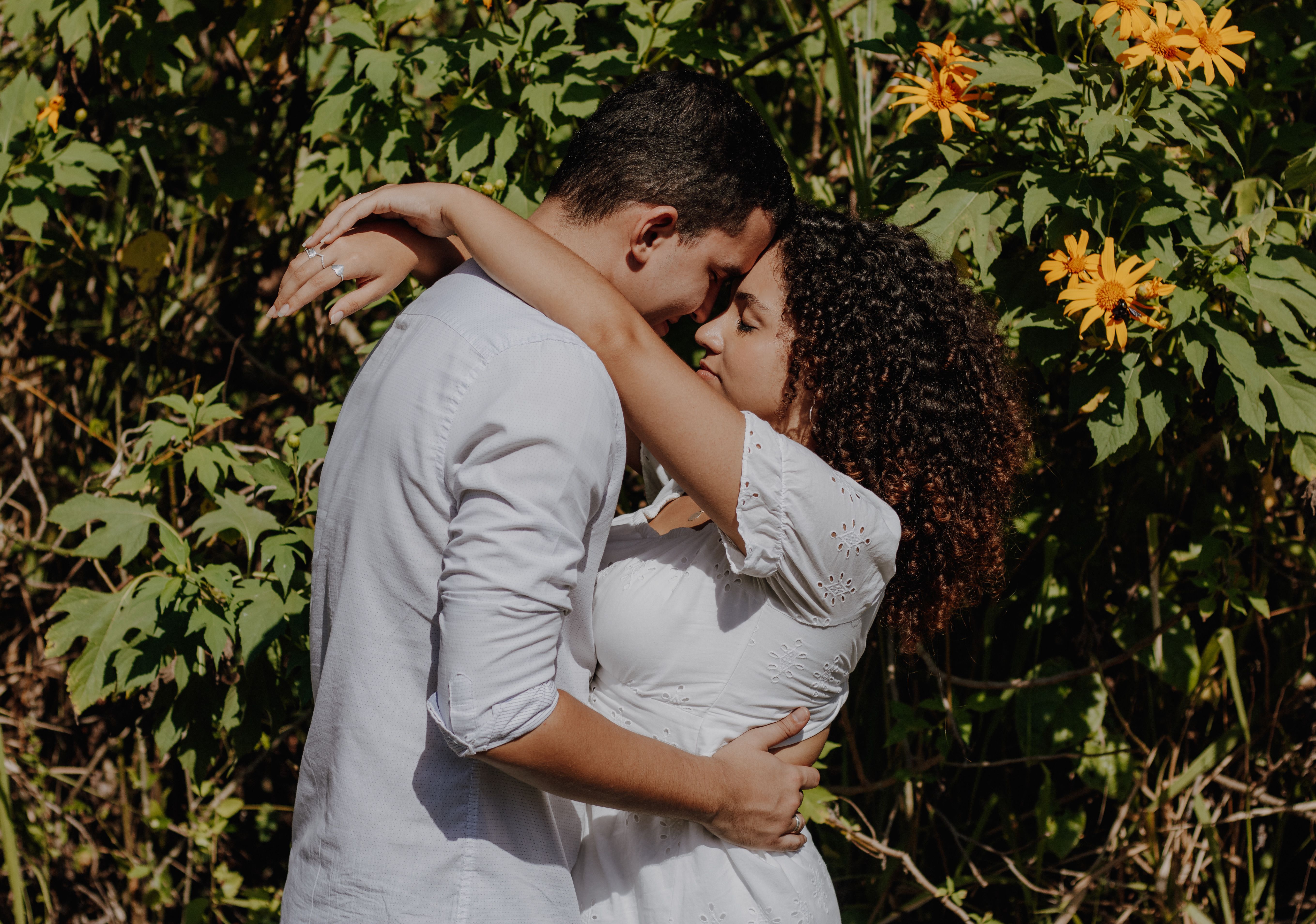 Couple Kissing Among Shrubs · Free Stock Photo
