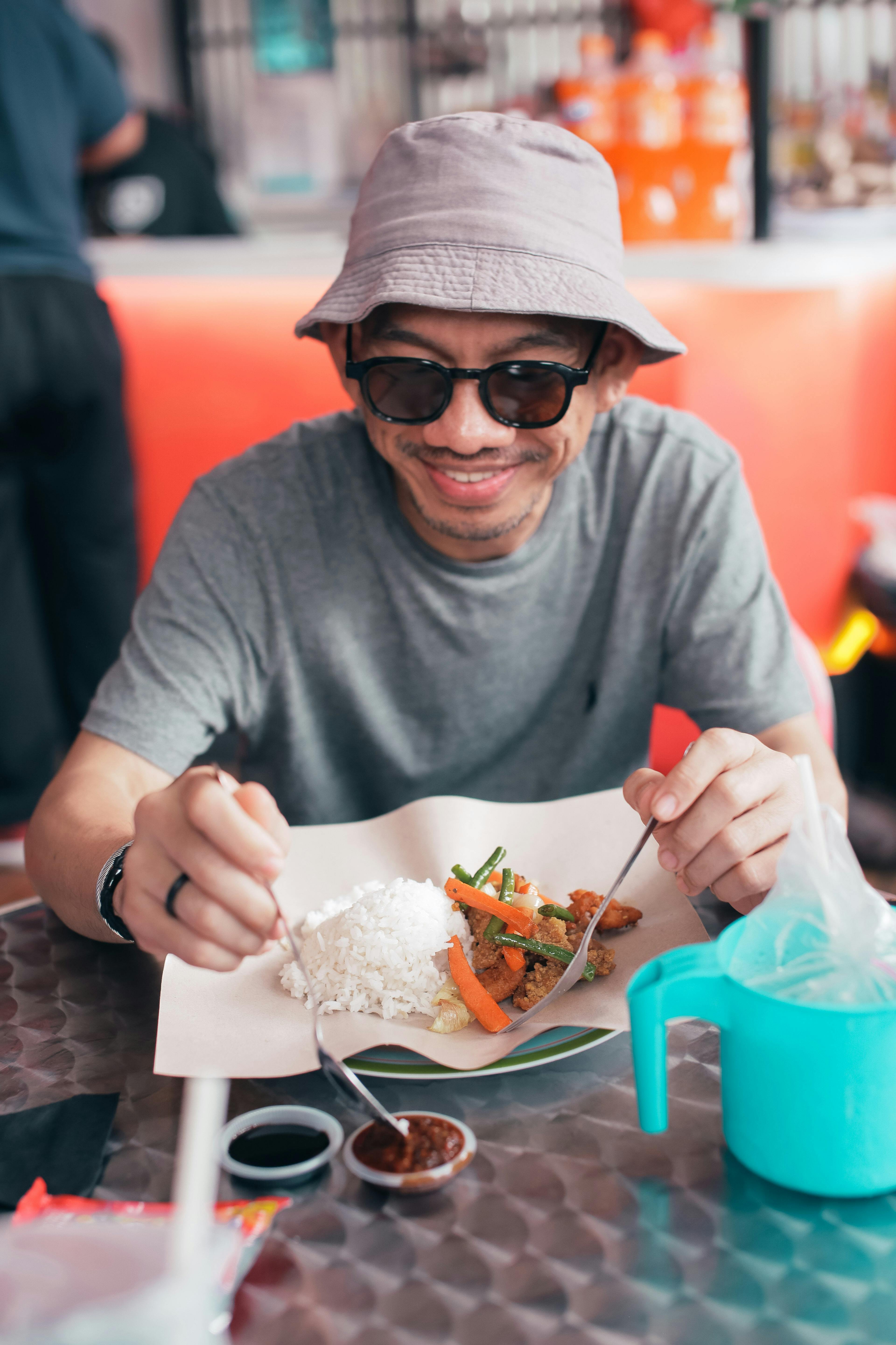 Man Eating Rice in a Restaurant · Free Stock Photo