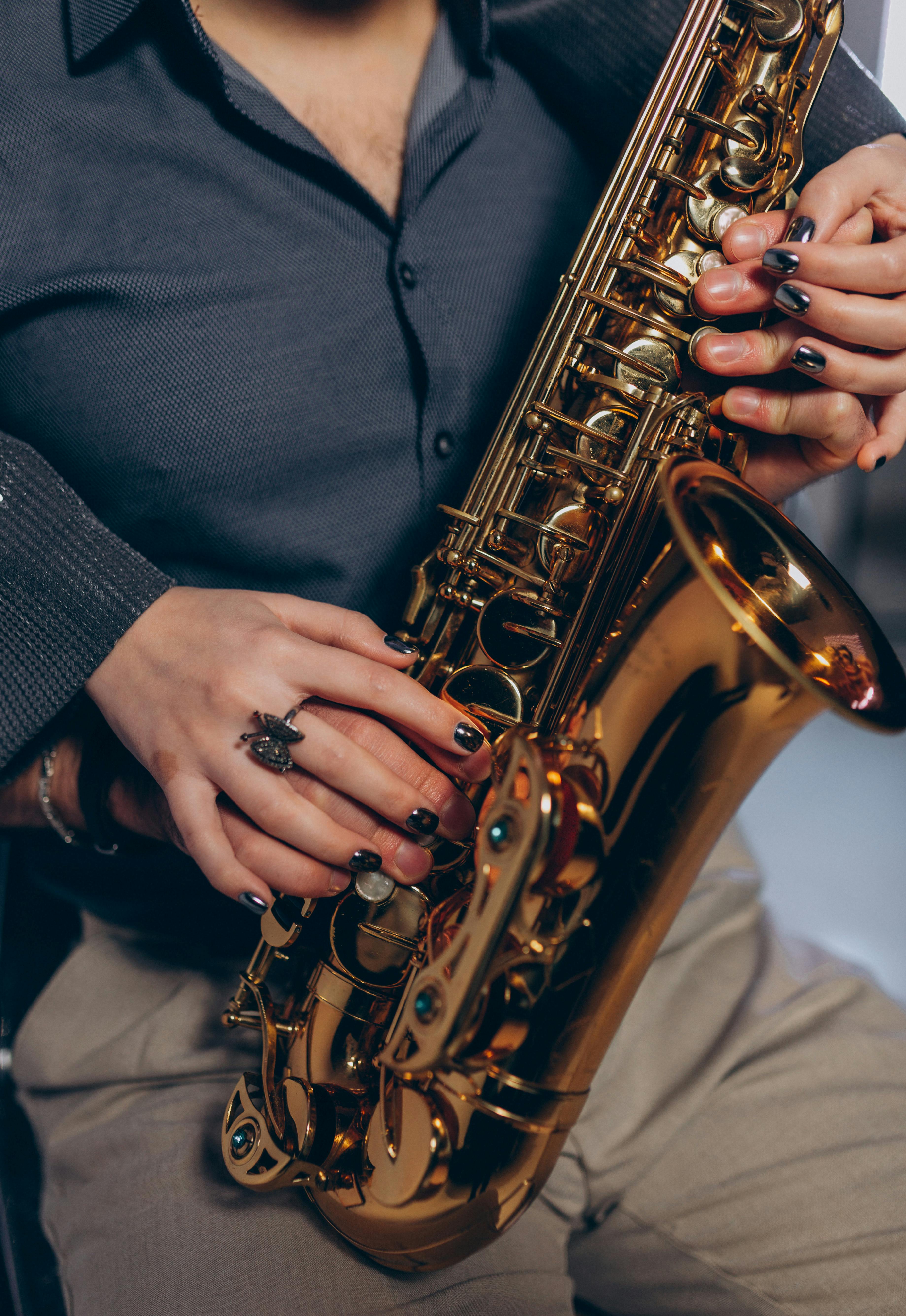Couple Playing Saxophone Together · Free Stock Photo