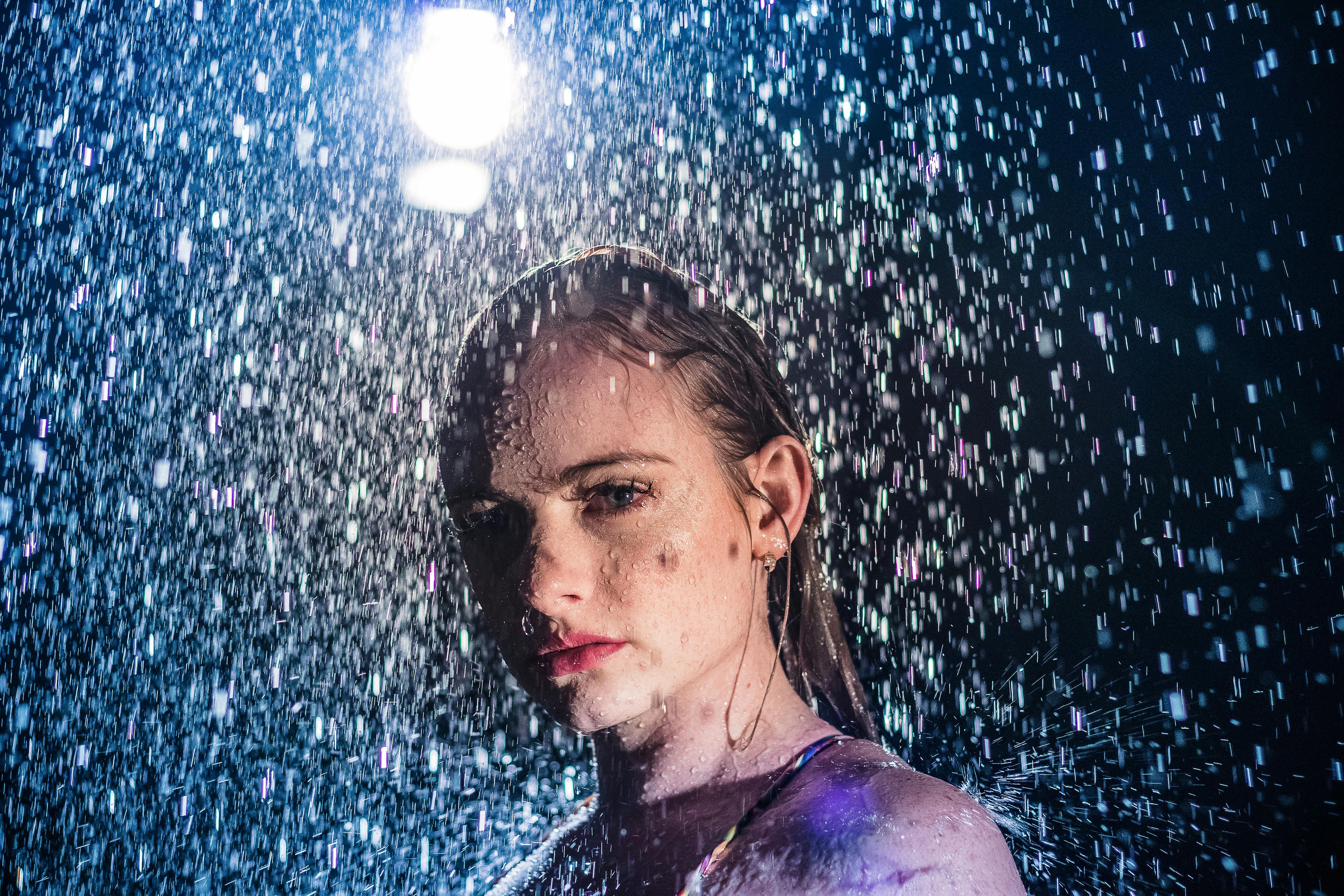 Woman in Rain of Light · Free Stock Photo