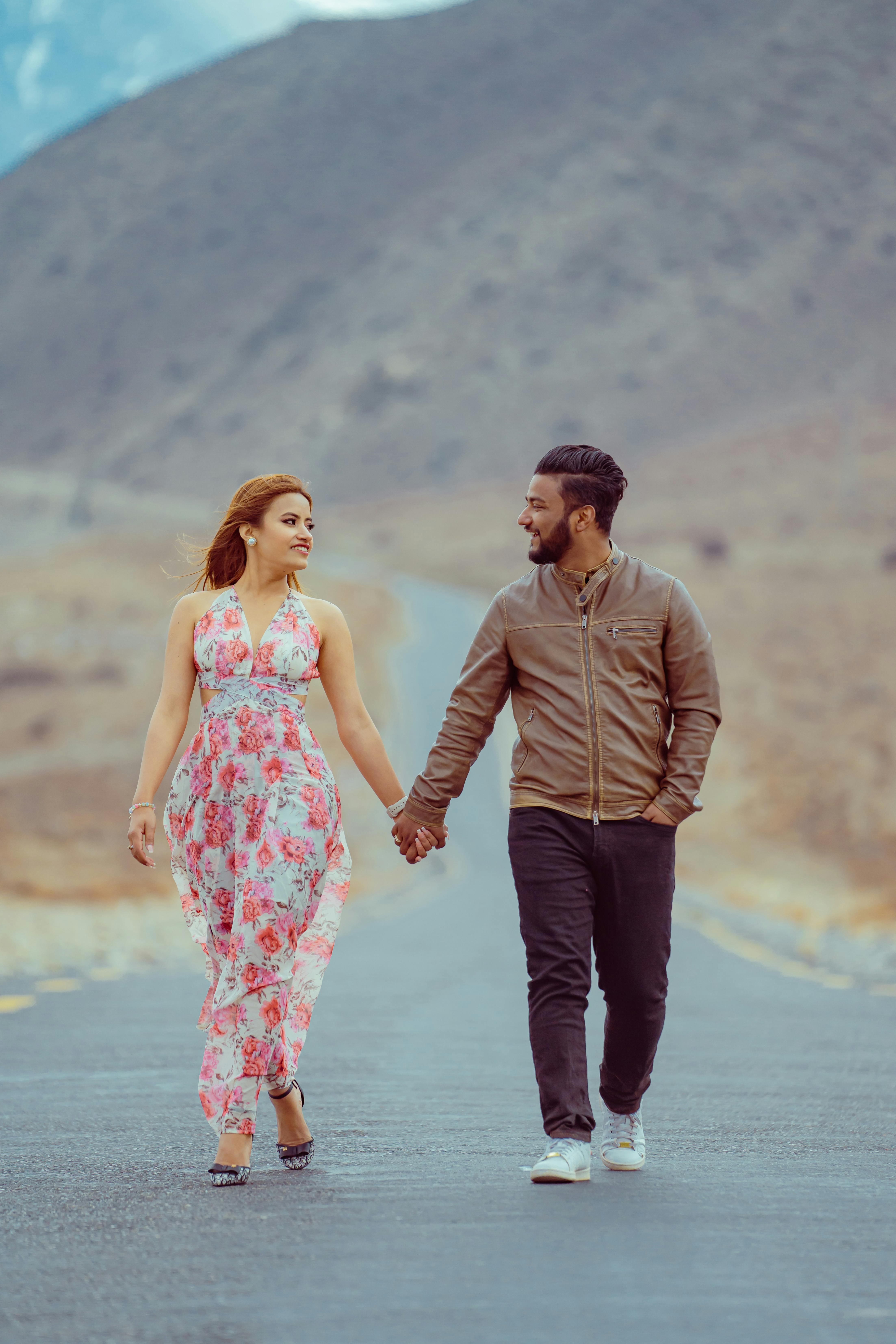Holding Hands Couple Walking Rural Road · Free Stock Photo