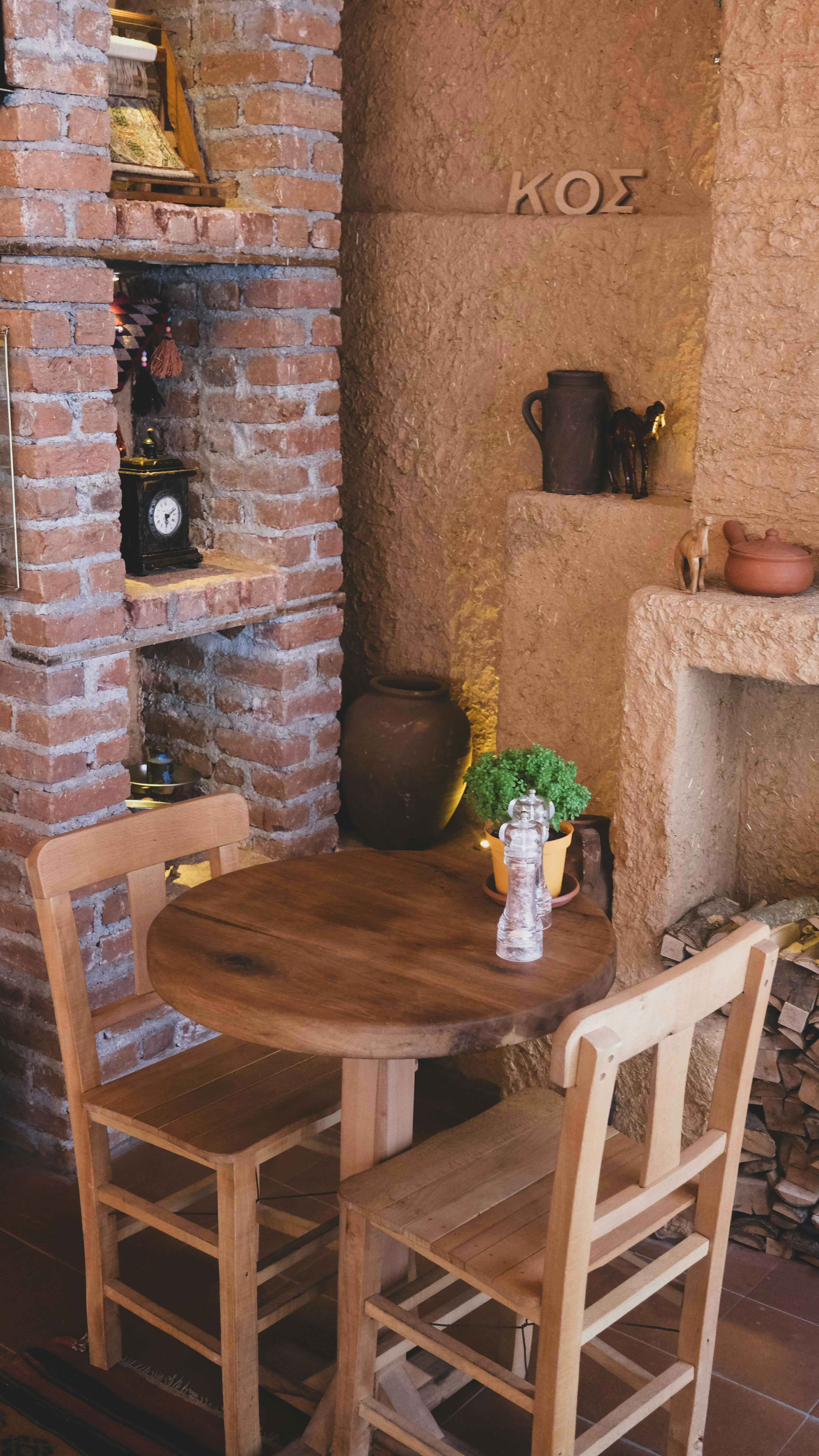 A Wooden table and Chairs Inside a Restaurant · Free Stock Photo