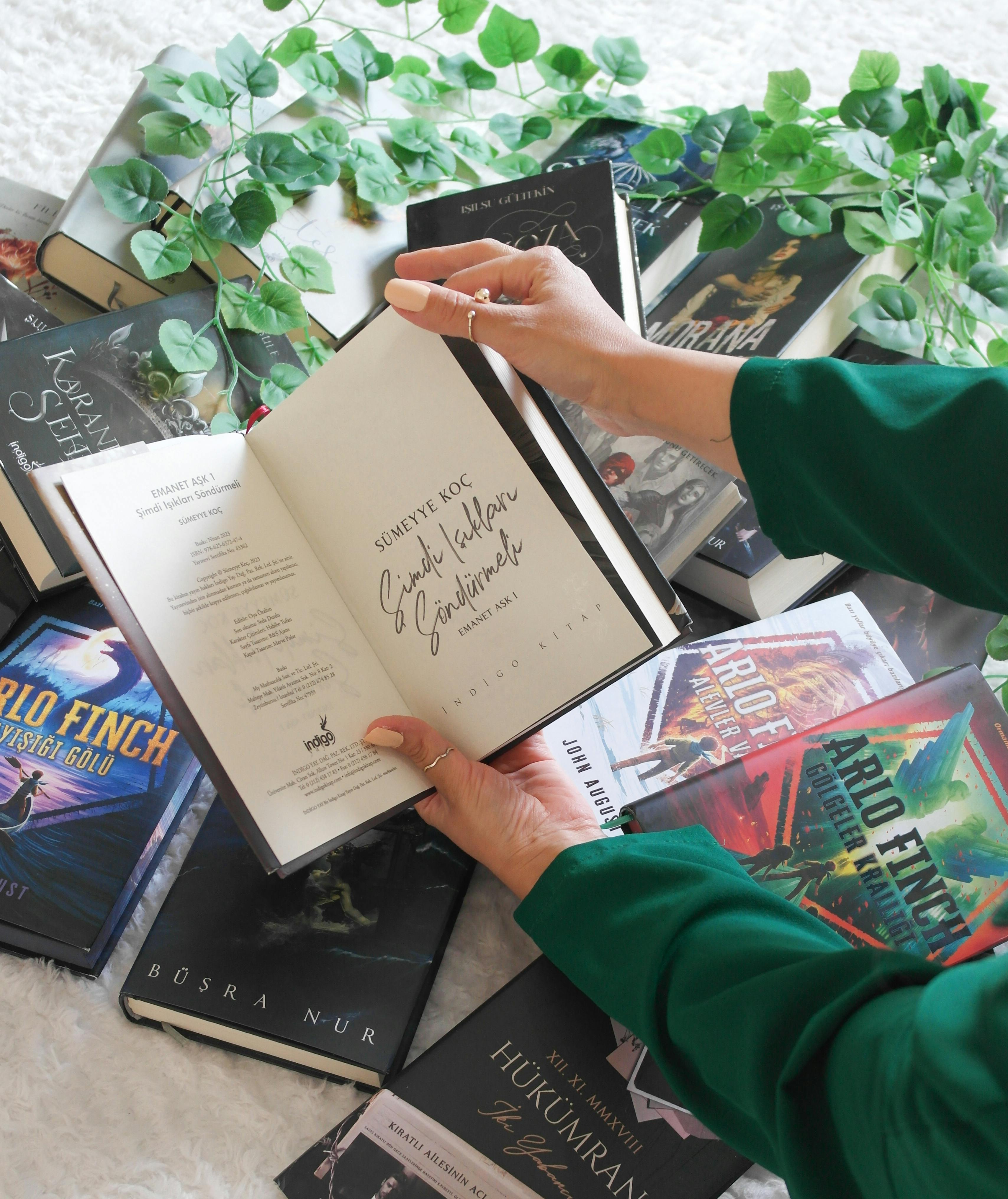 Pile Of Books On Hand · Free Stock Photo