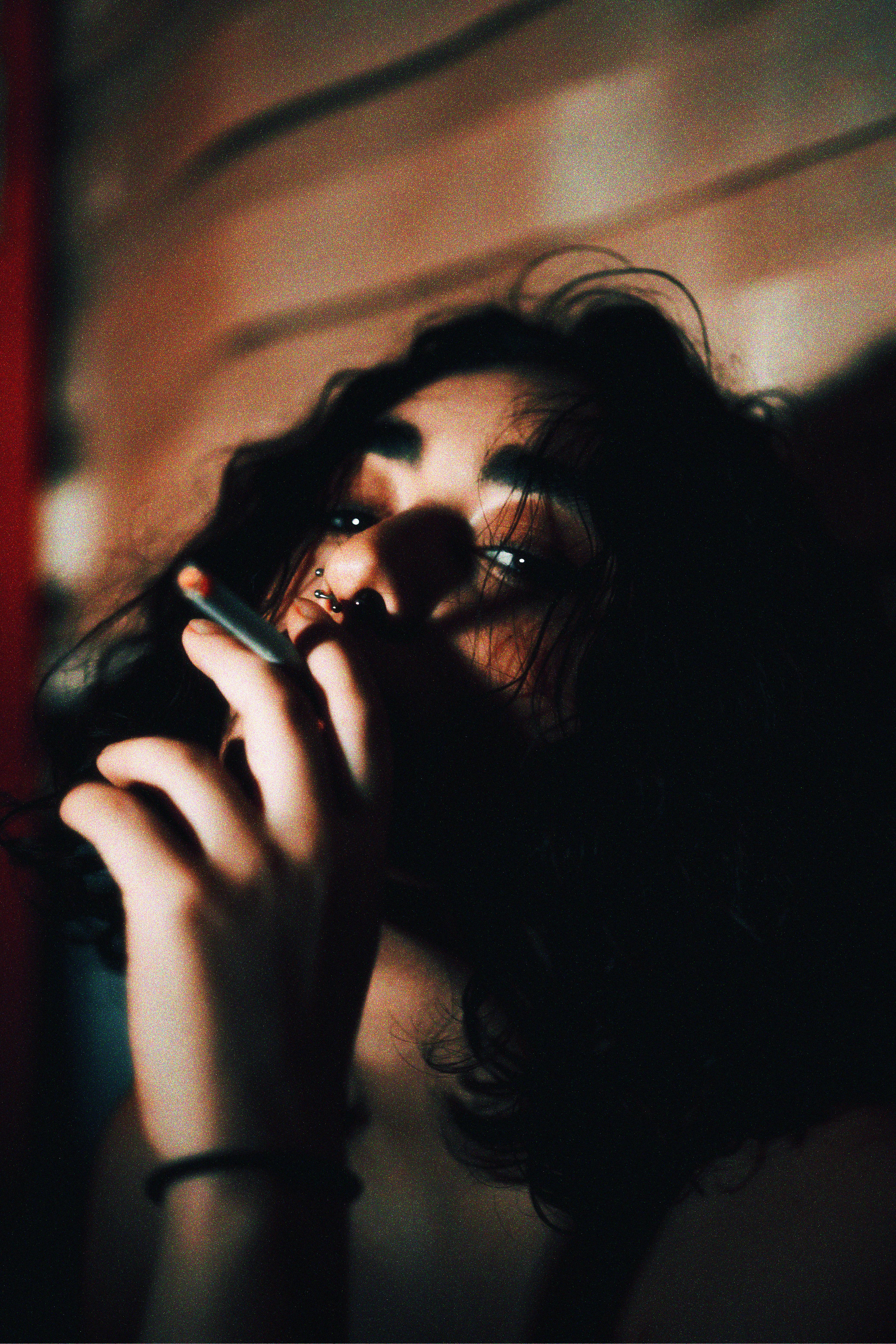 Portrait of Woman Smoking a Cigarette · Free Stock Photo