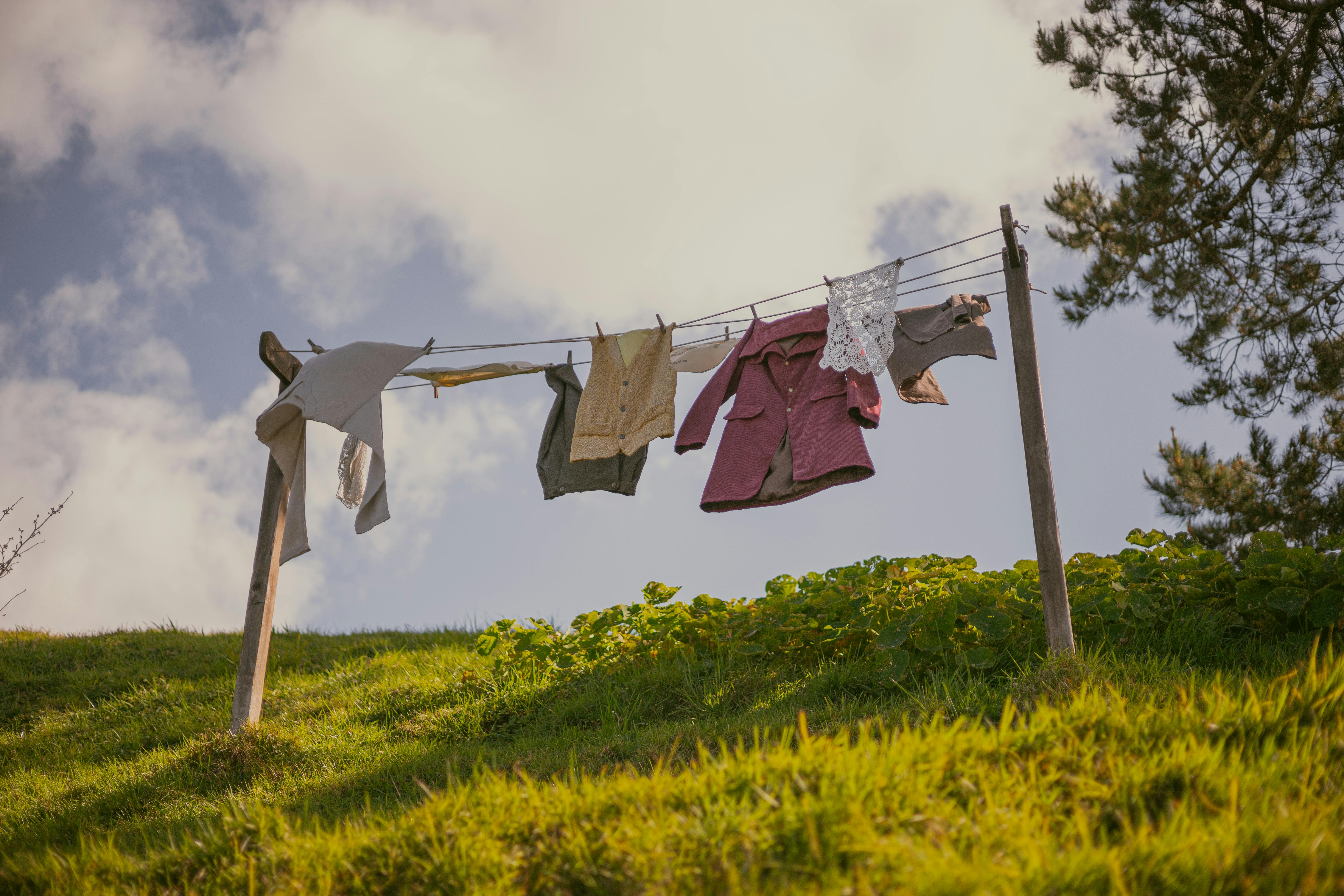 View of Laundry Drying on the Clotheslines on a Field · Free Stock Photo