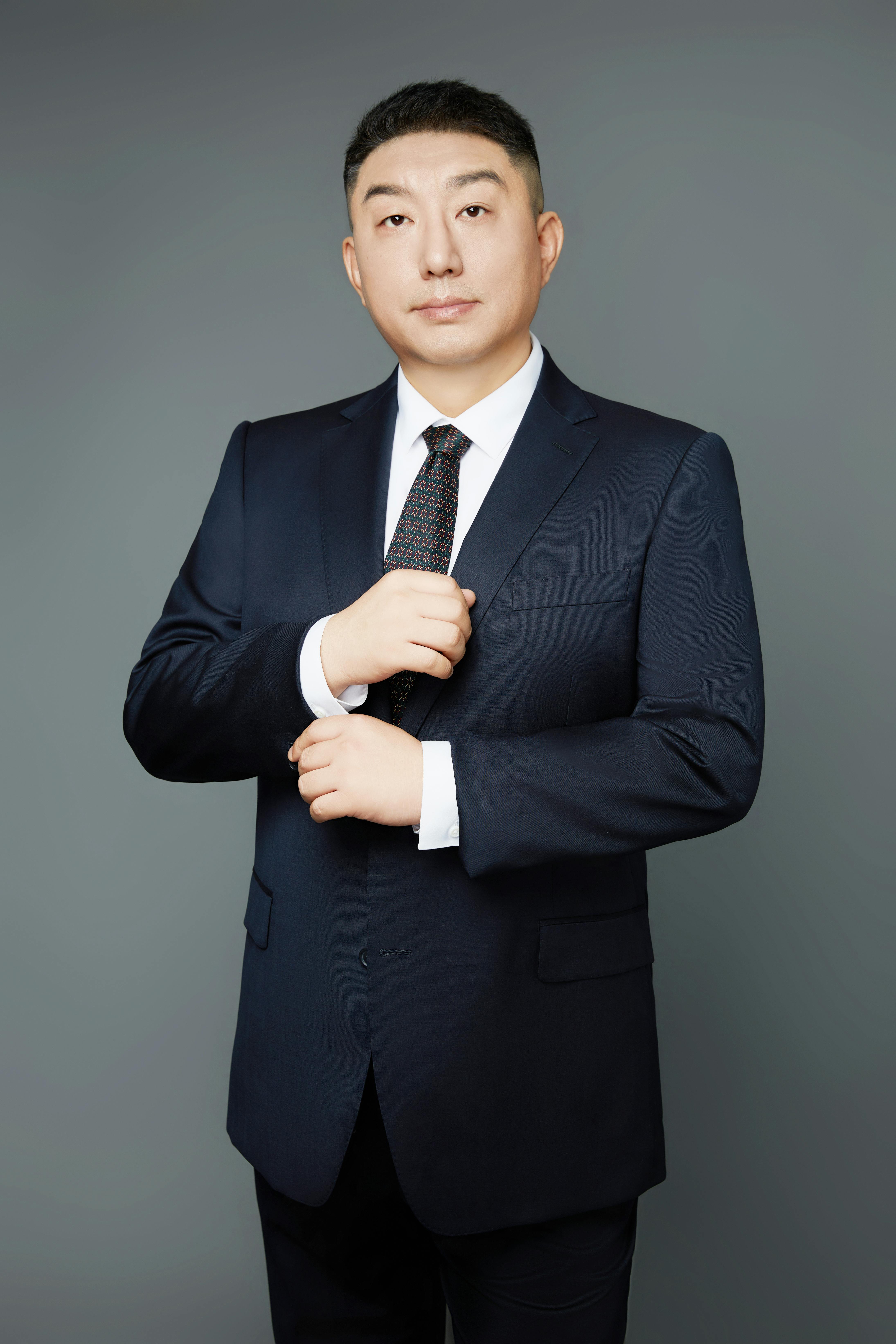 Business Man Fixing Shirt Cuff · Free Stock Photo