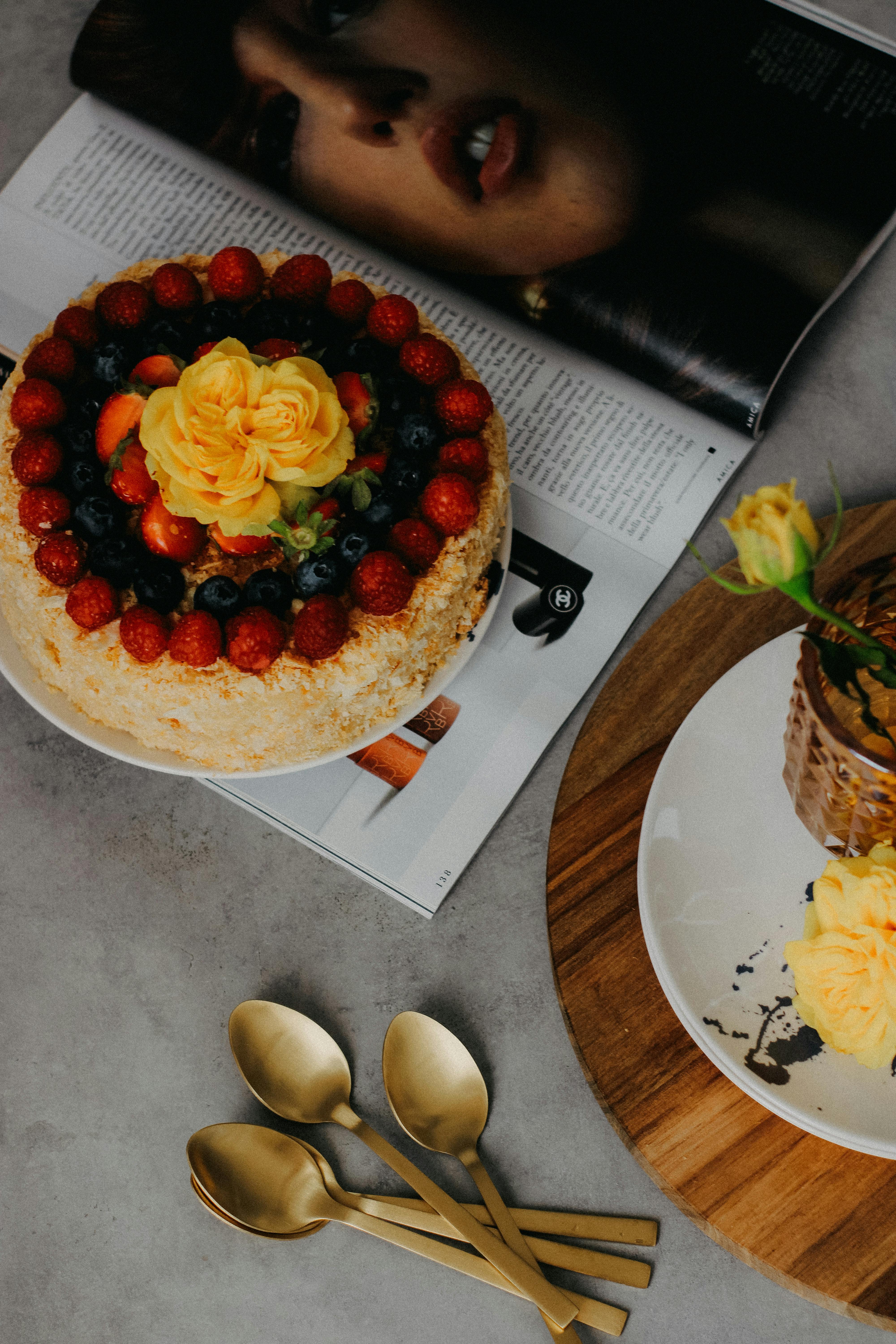 Golden Spoons a Cake and Magazine on the Table · Free Stock Photo