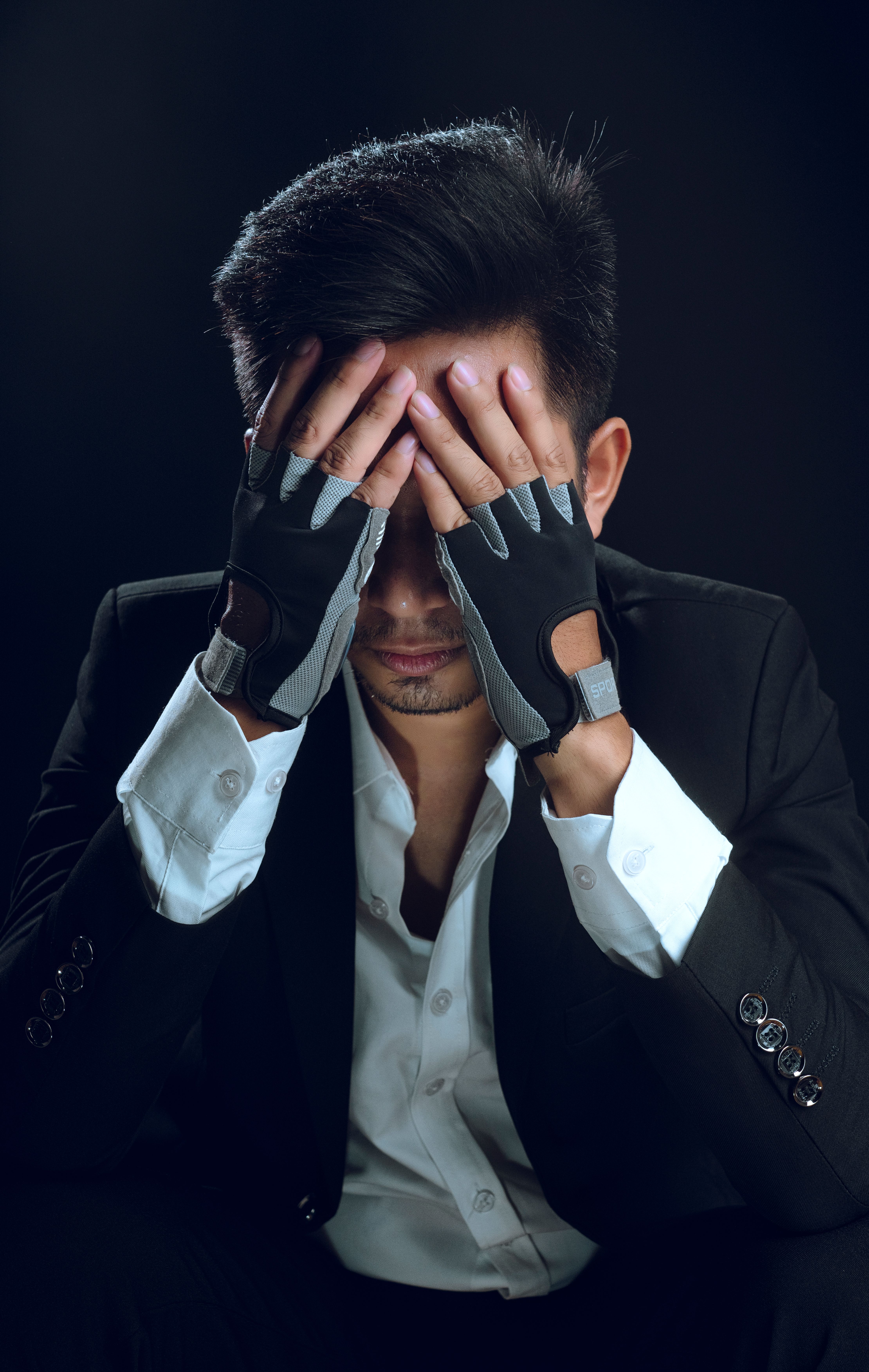 Man in Suit with Hands on Face · Free Stock Photo