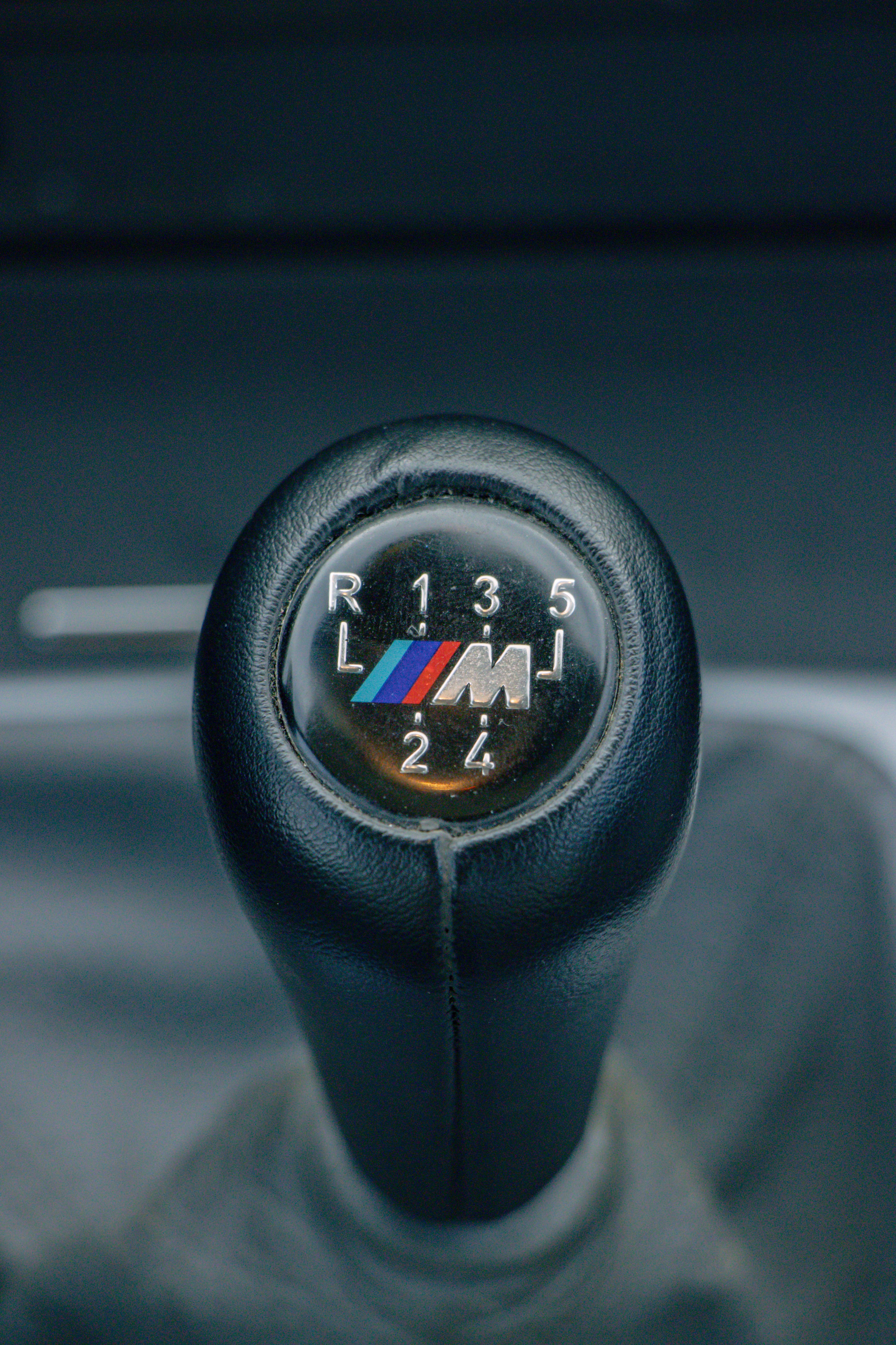 A close up of a gear stick with the bmw logo · Free Stock Photo