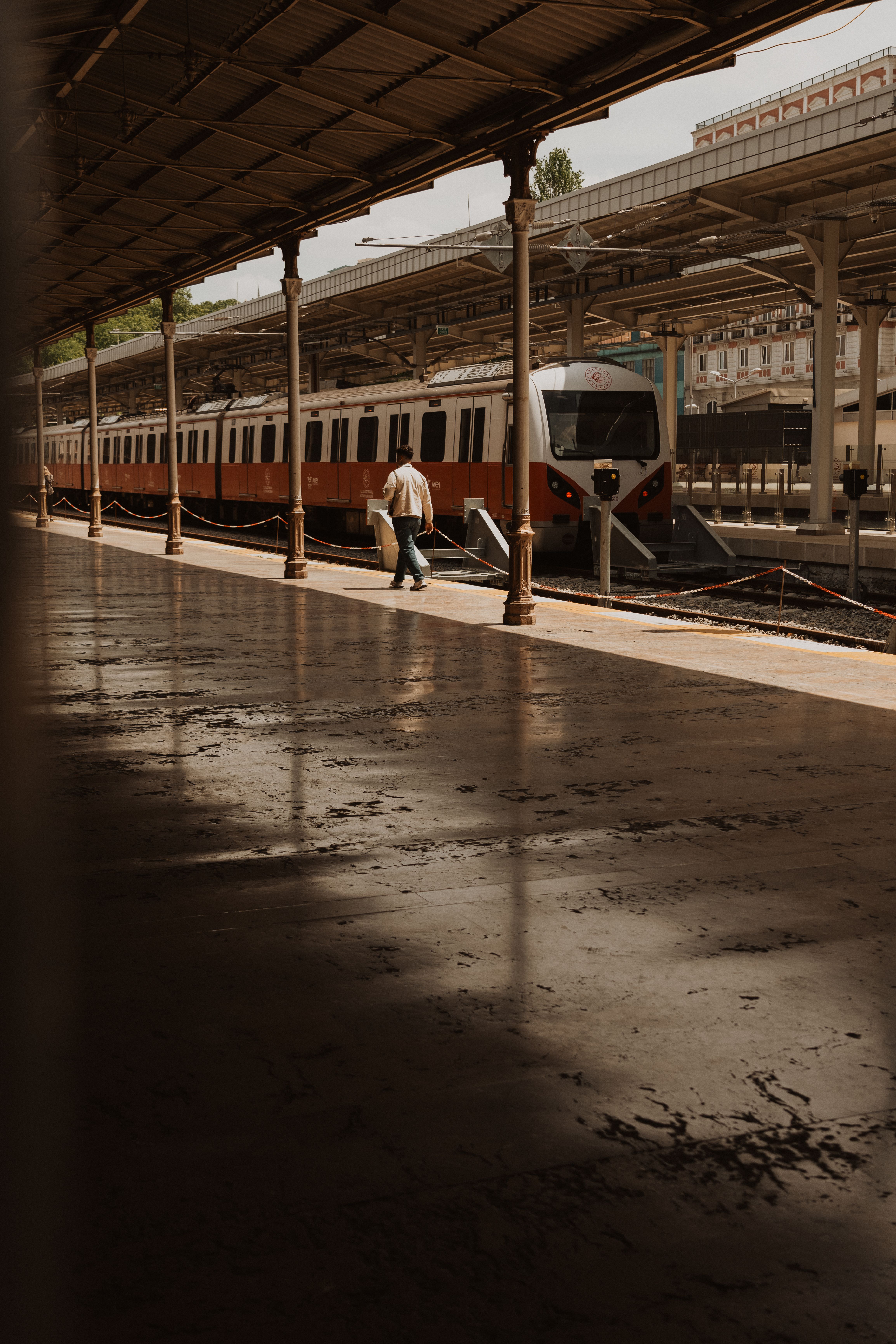 Person Walking at Railway Station Platform · Free Stock Photo