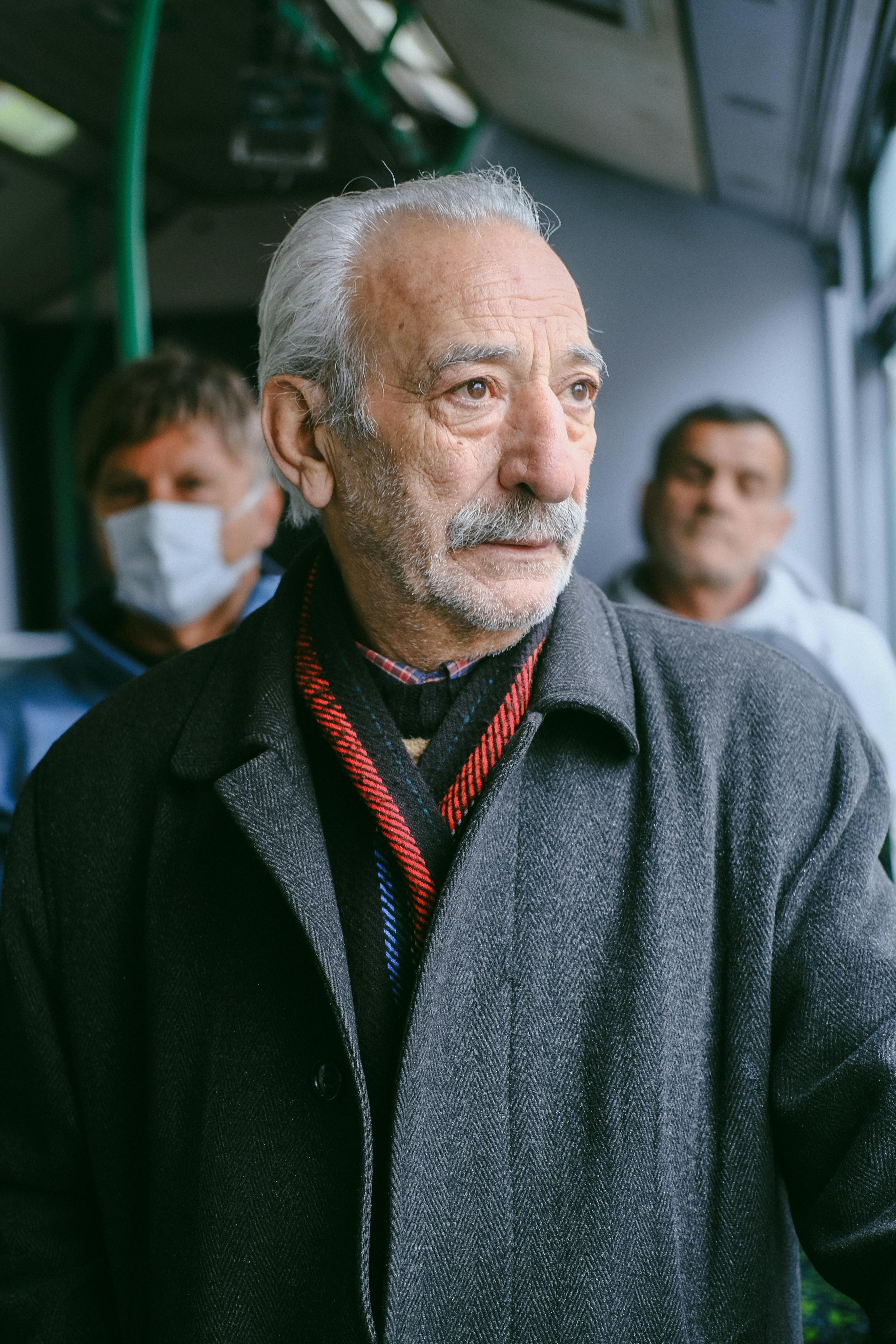Thoughtful Old Man on the Bus · Free Stock Photo