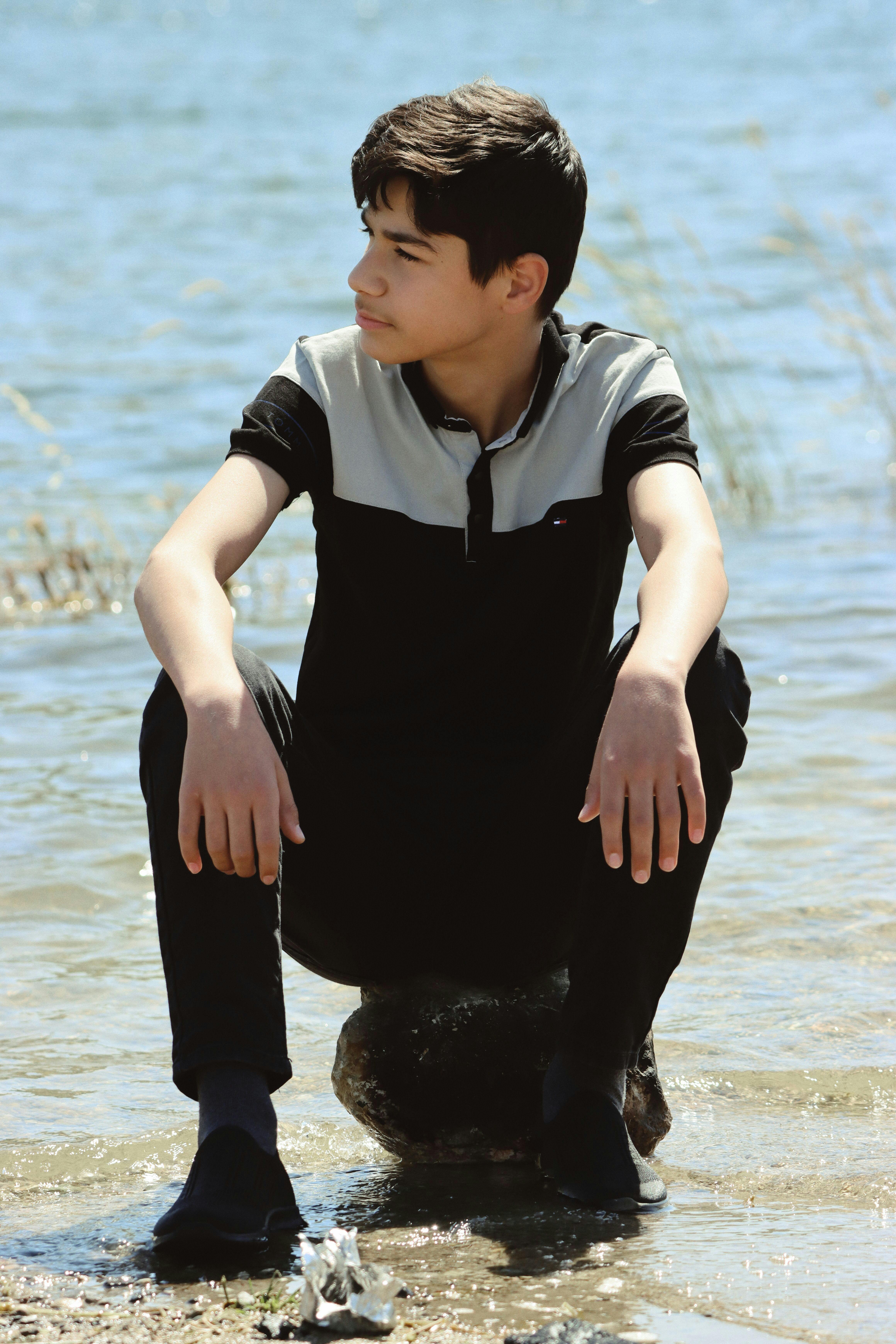 Somone Sitting On A Rock Man Photos, Download The BEST Free Somone ...