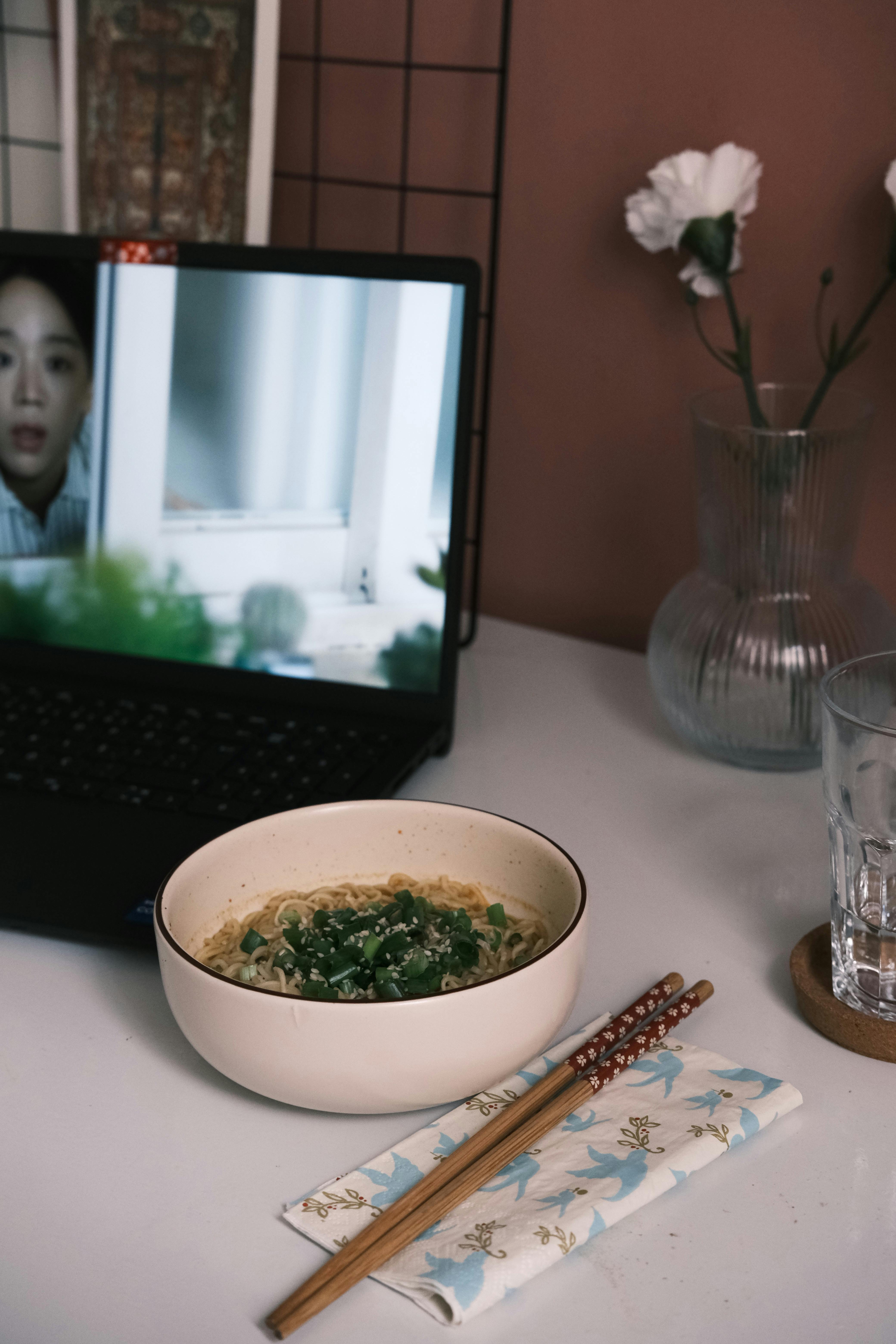 Laptop, Bowl of Noodles and Chopsticks · Free Stock Photo