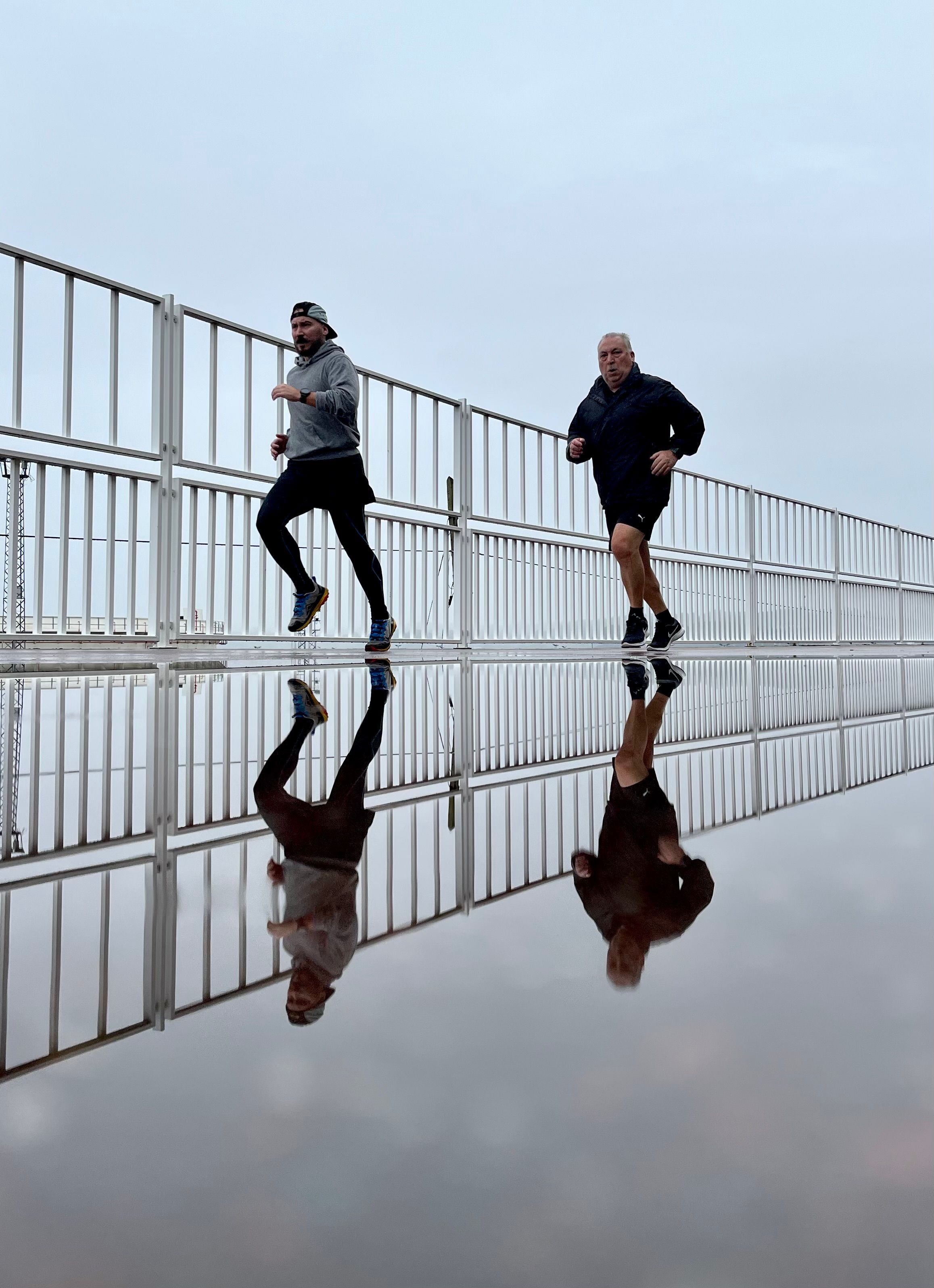 Men Running near Puddle · Free Stock Photo