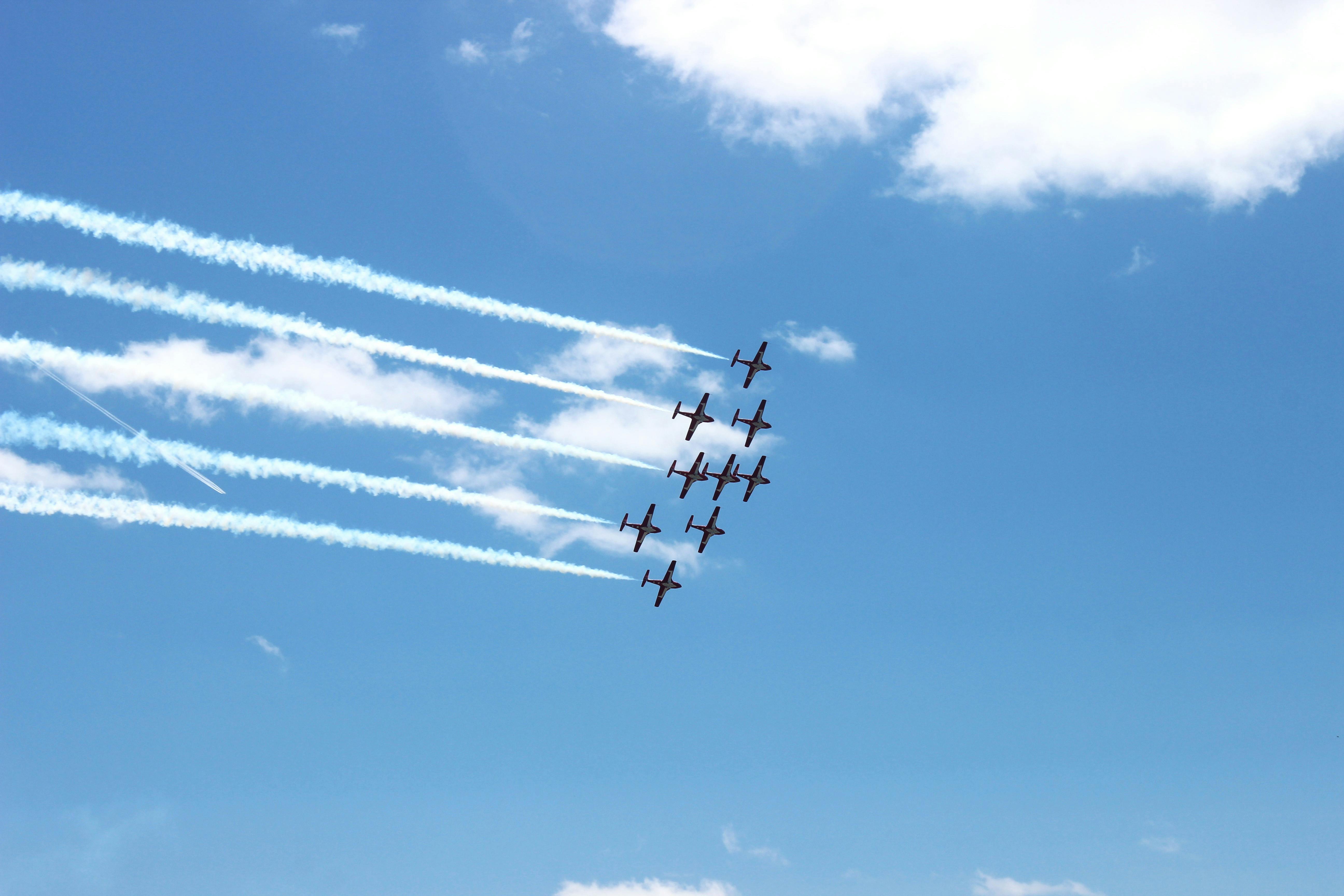 A group of planes flying in formation in the sky · Free Stock Photo
