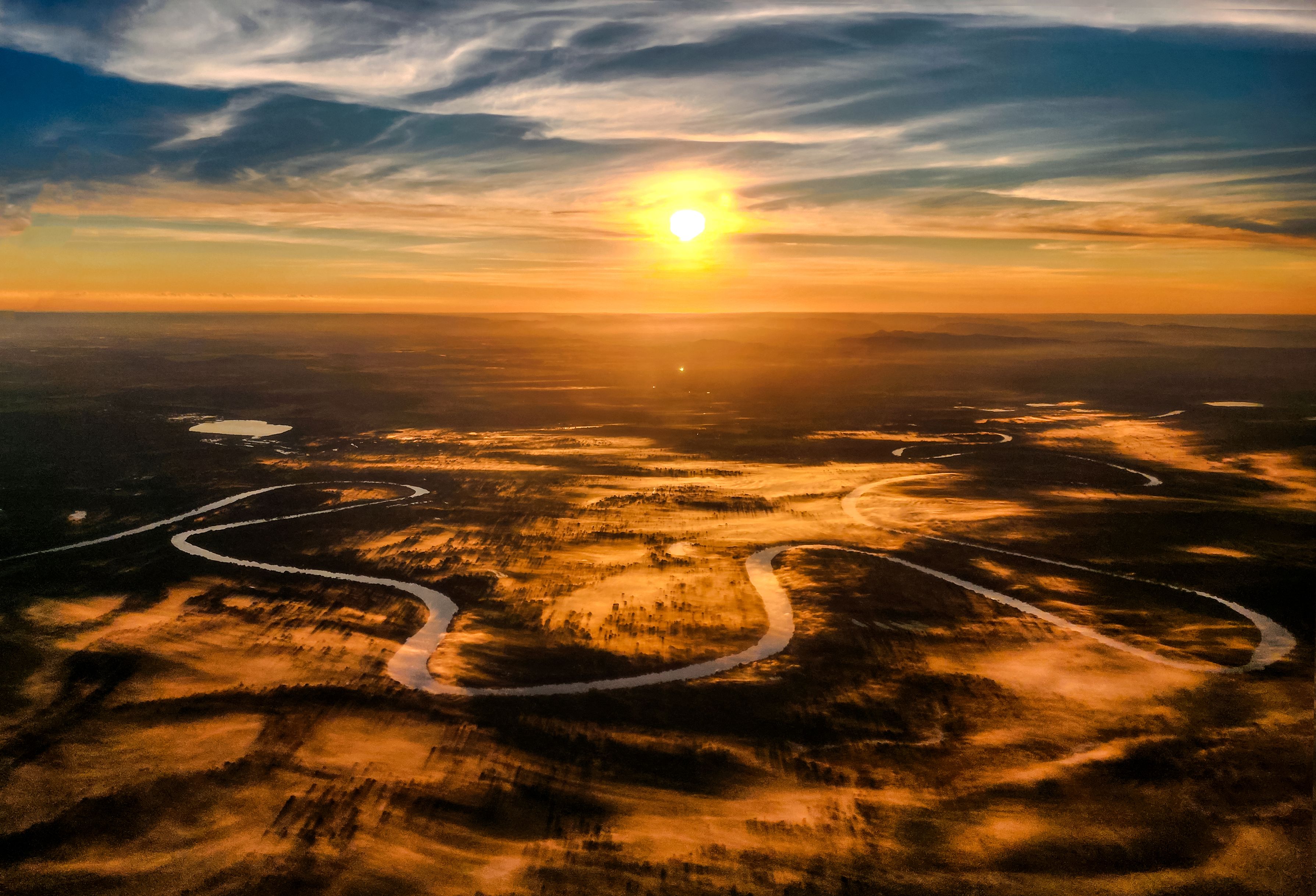 Sunset Sunlight over River on Plains · Free Stock Photo