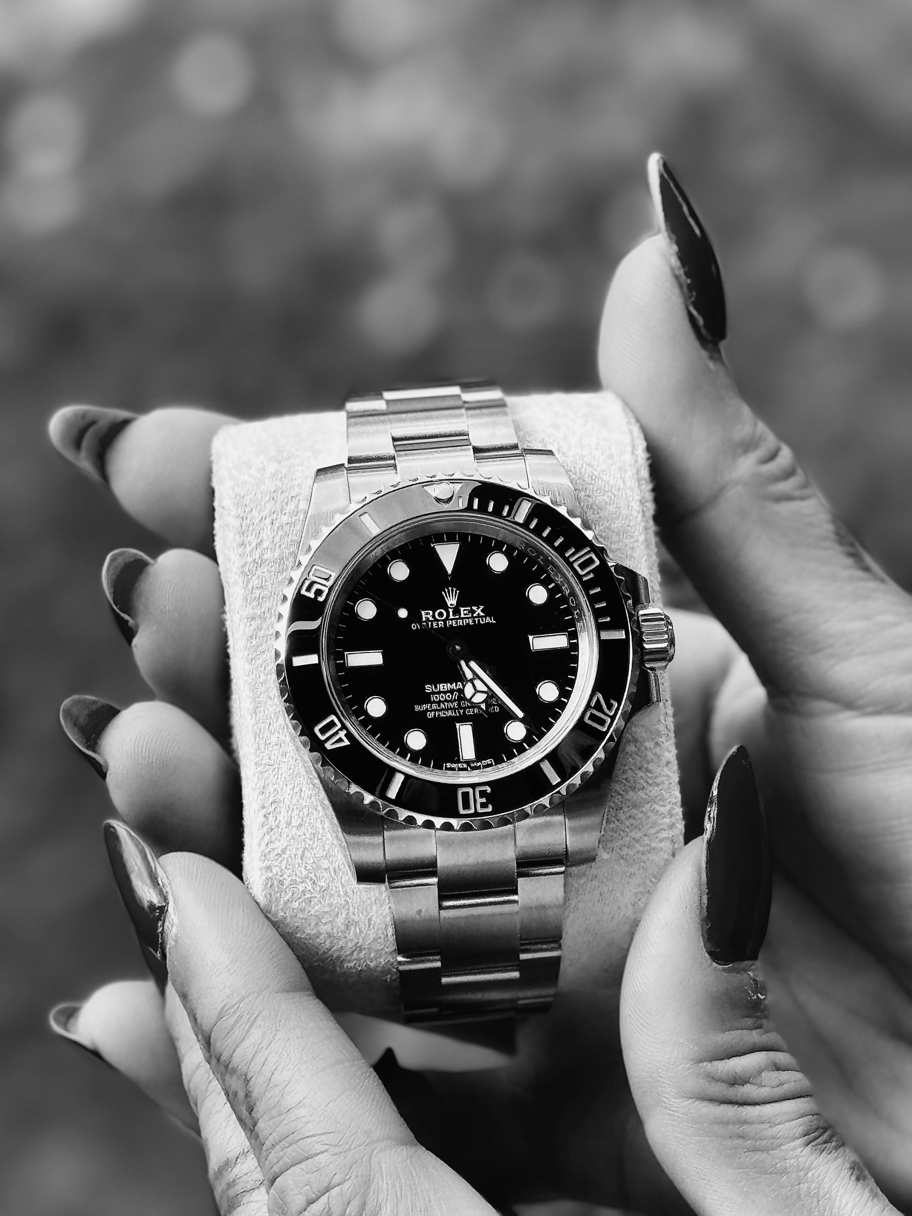 Close-up of a Rolex in a Womans Hands · Free Stock Photo