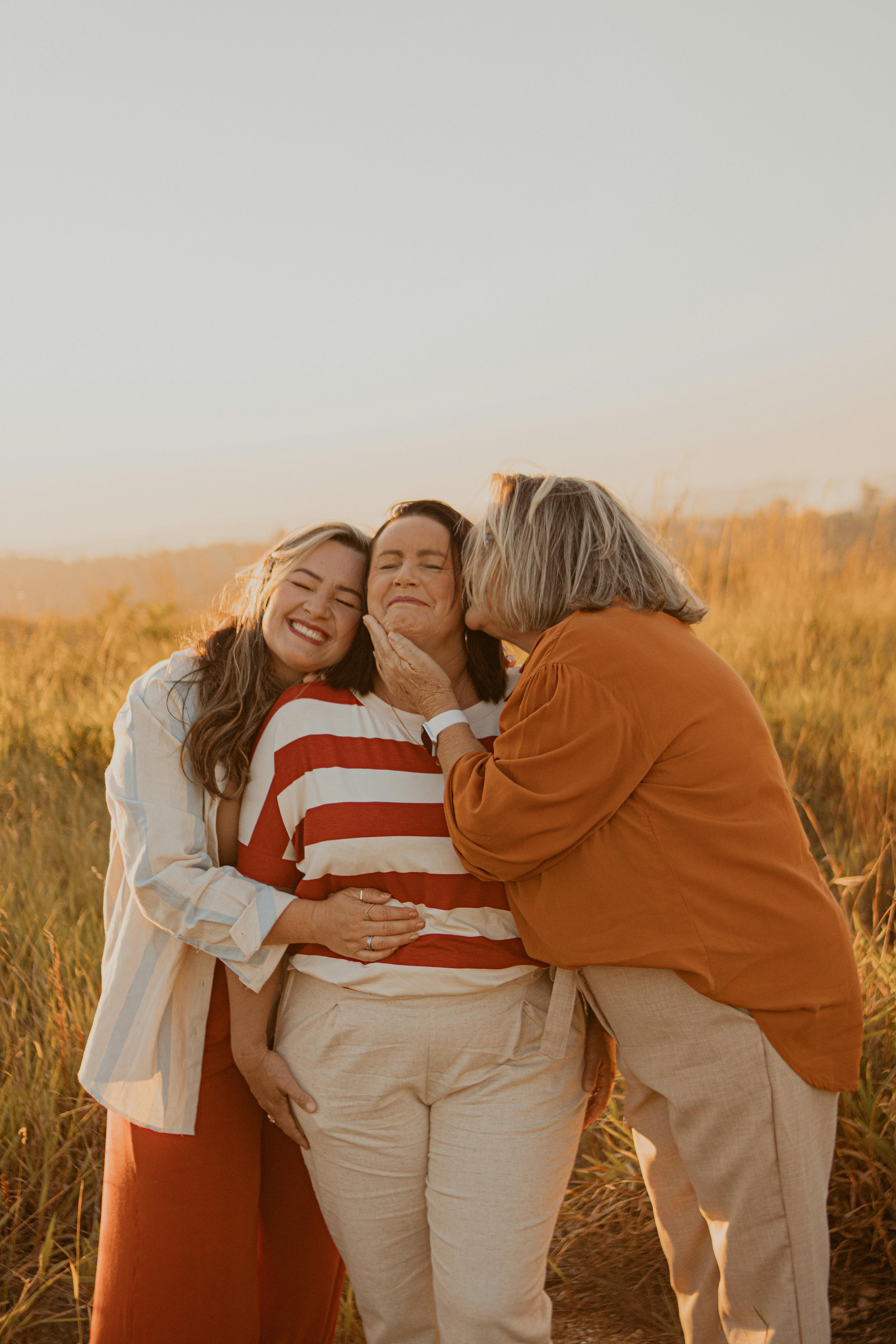 Standing Friends on Meadow at Dusk · Free Stock Photo
