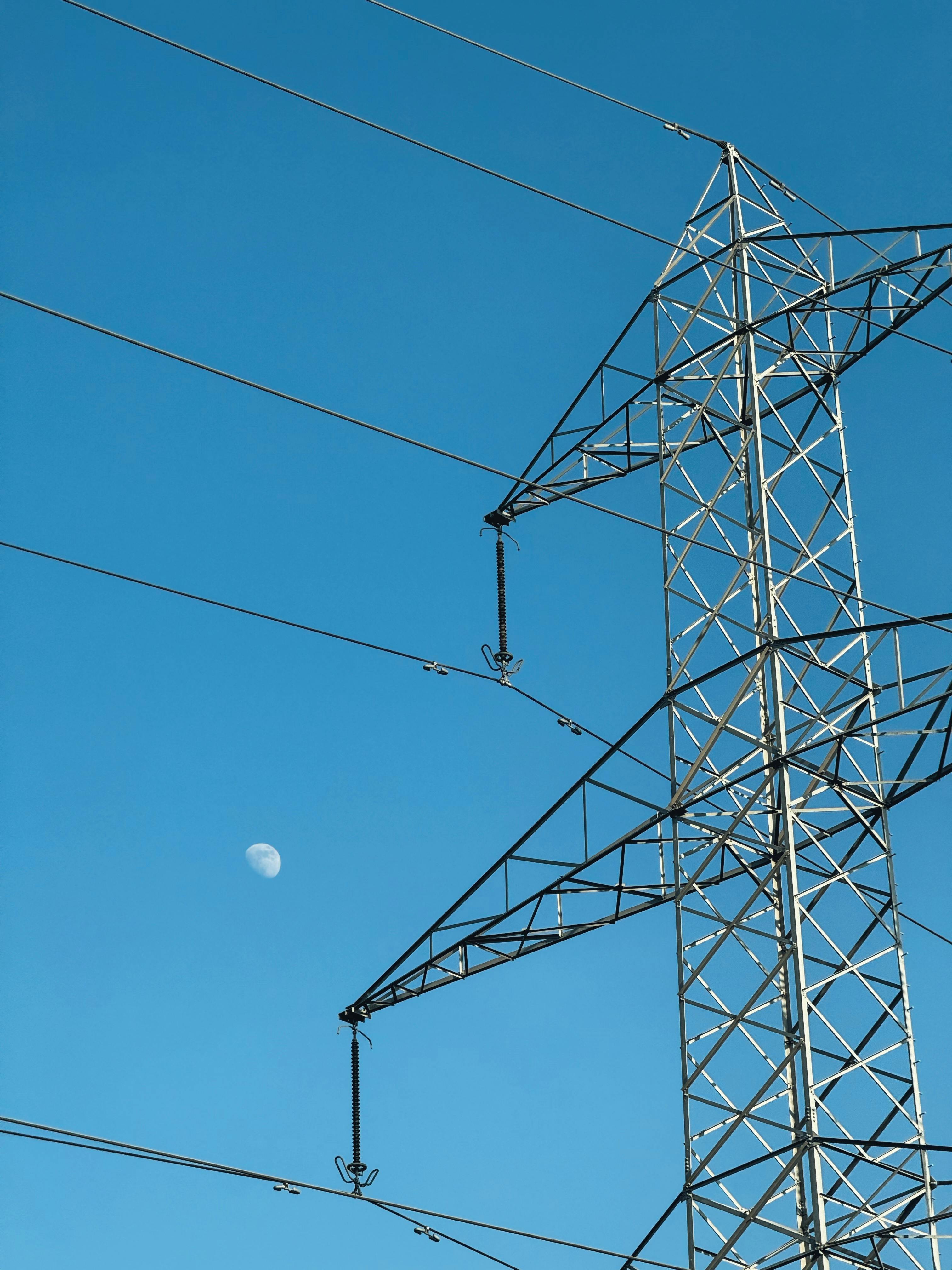 Low Angle Shot of a Utility Pole and Power Lines · Free Stock Photo