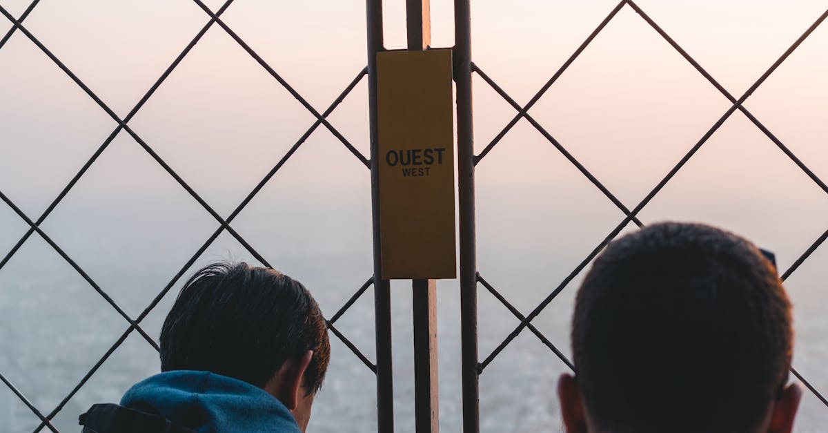 Two Men Standing Near Gate · Free Stock Photo Two Men Standing Near Gate · Free Stock Photo