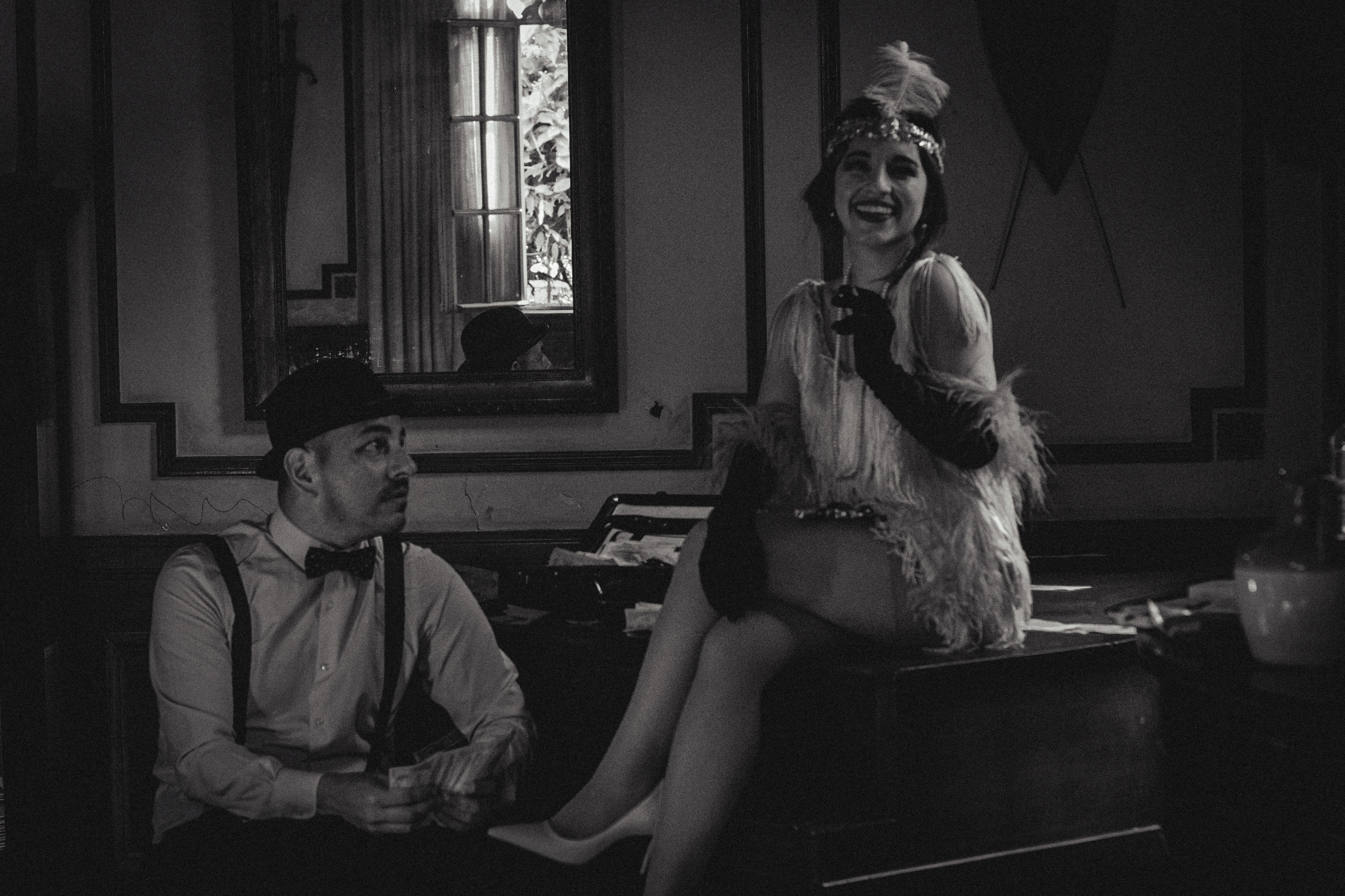 Smiling Woman in Flapper Dress Sitting with Man · Free Stock Photo