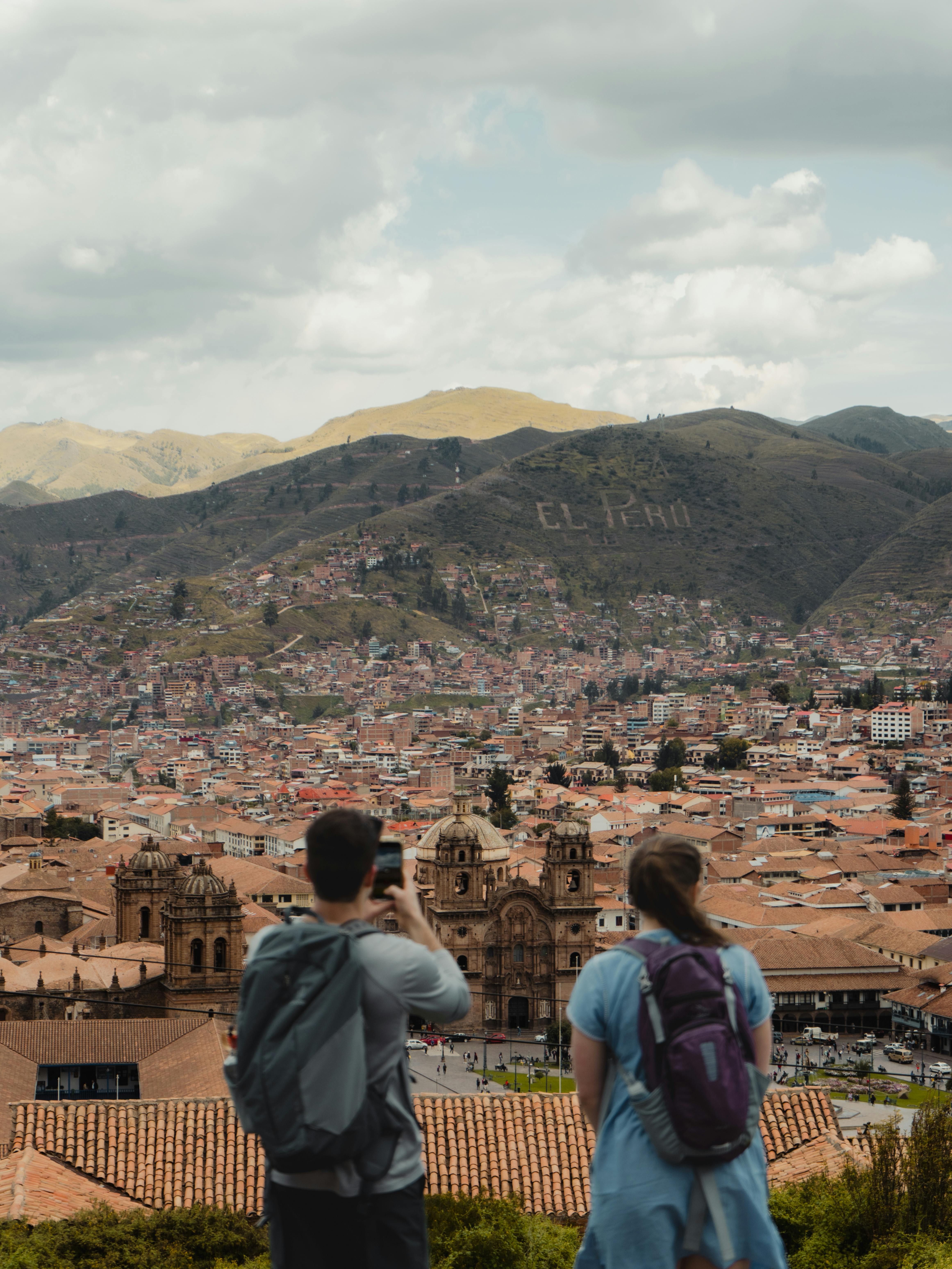 Back View of a Man and Woman Looking at the Panorama of Cusco, Peru ...