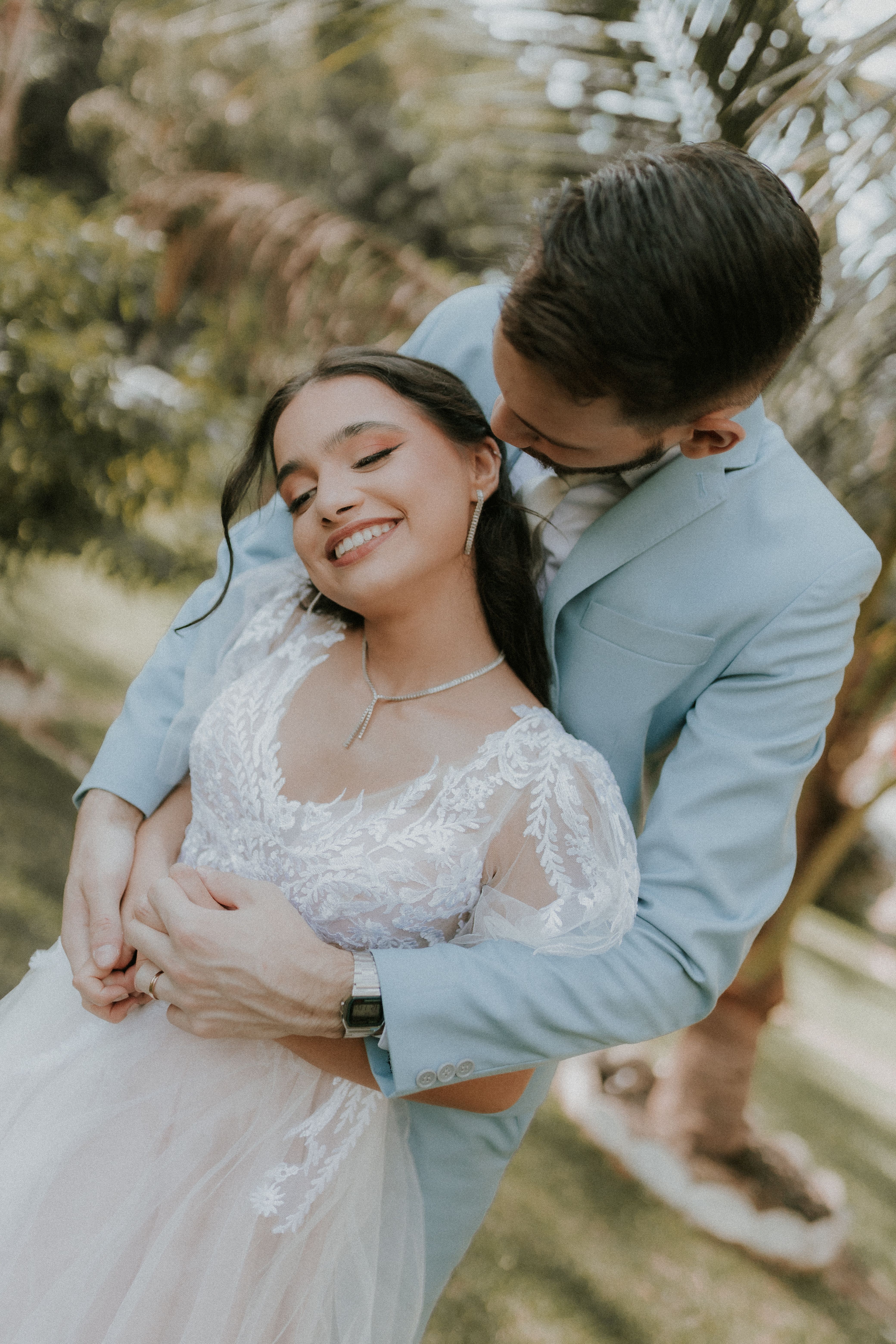 Groom Hugging Smiling Bride from behind · Free Stock Photo