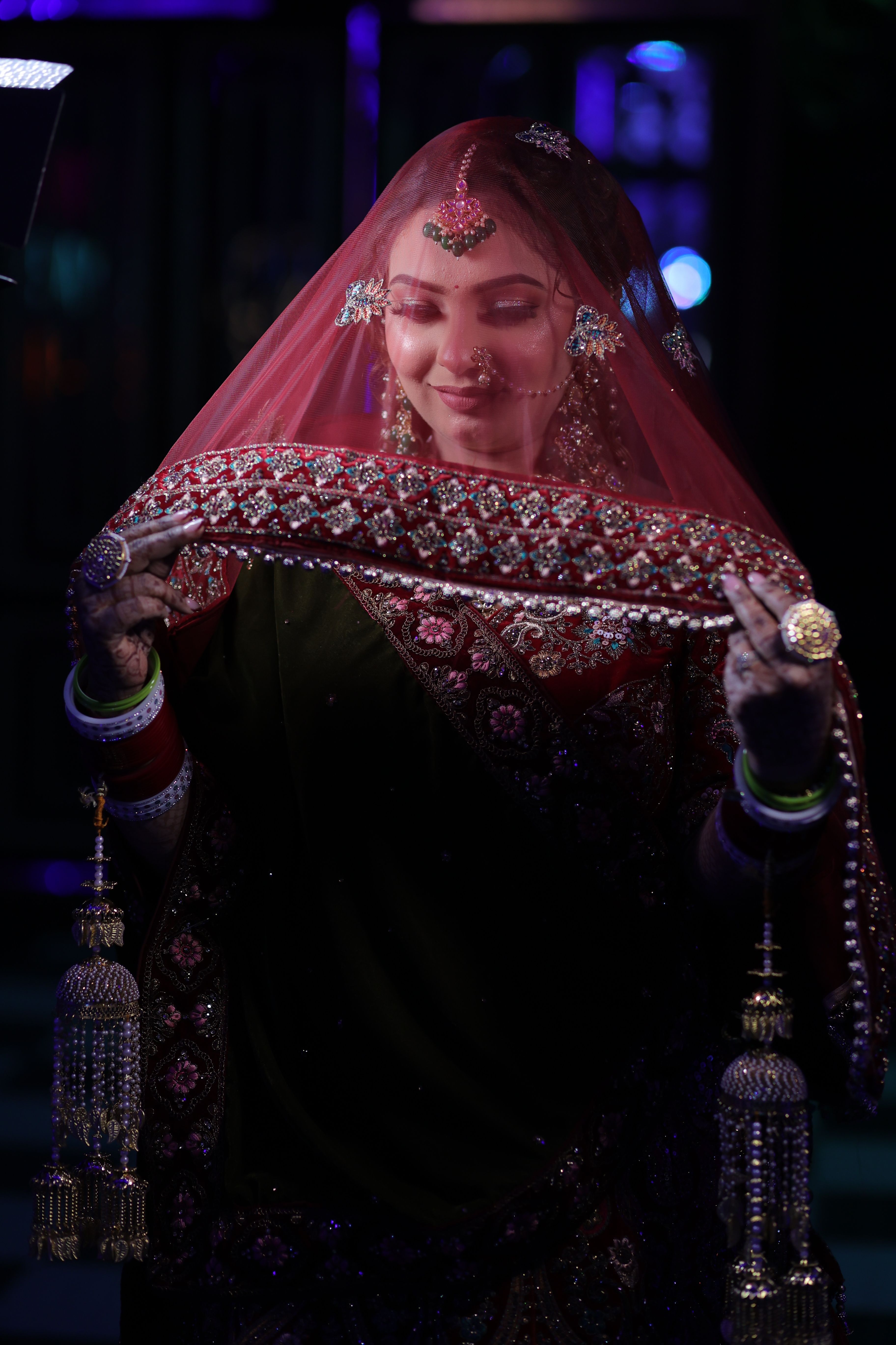 Bride in a Traditional Indian Wedding Attire Covering Her Face with a ...