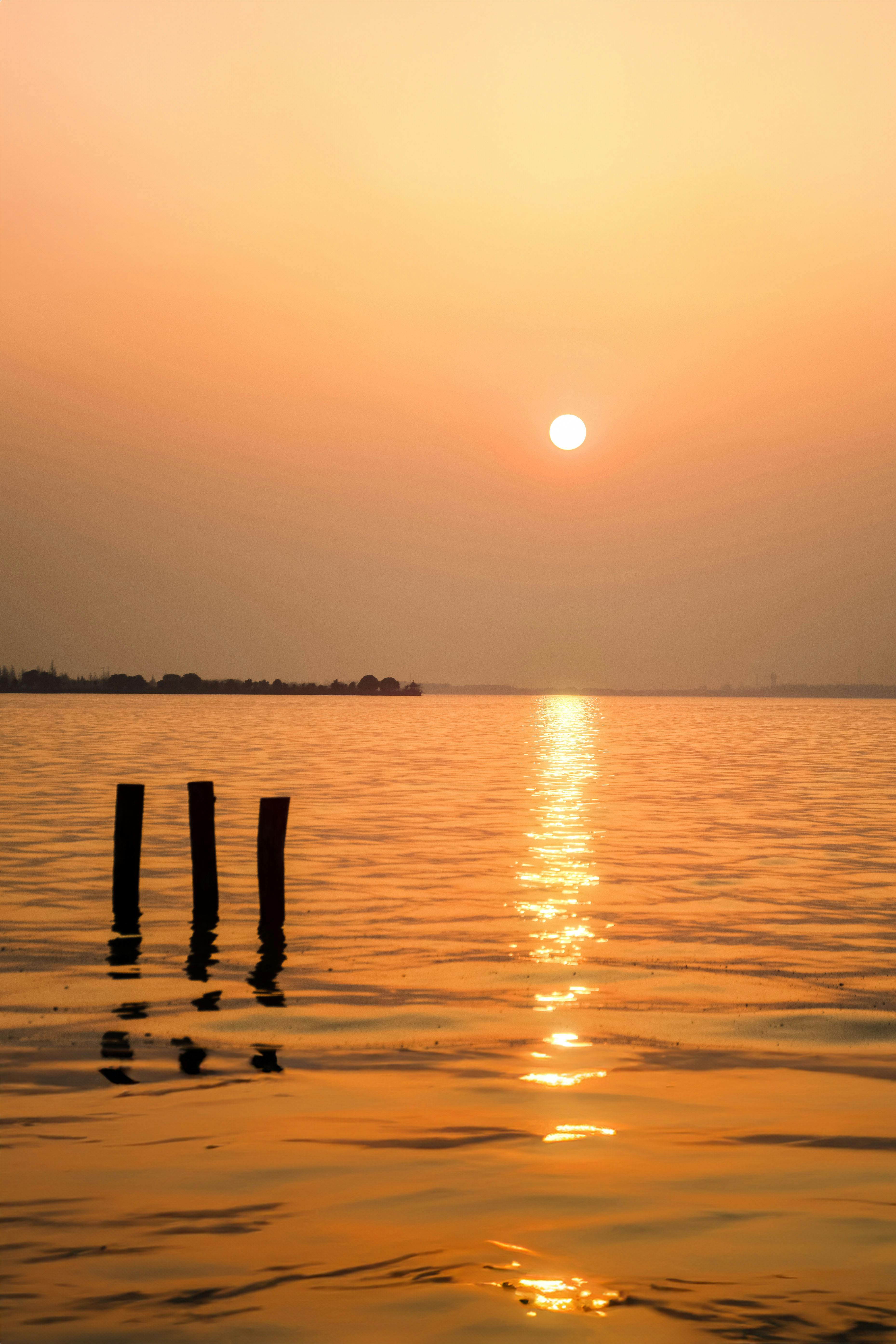 Sunset in Sky over Calm Seashore · Free Stock Photo