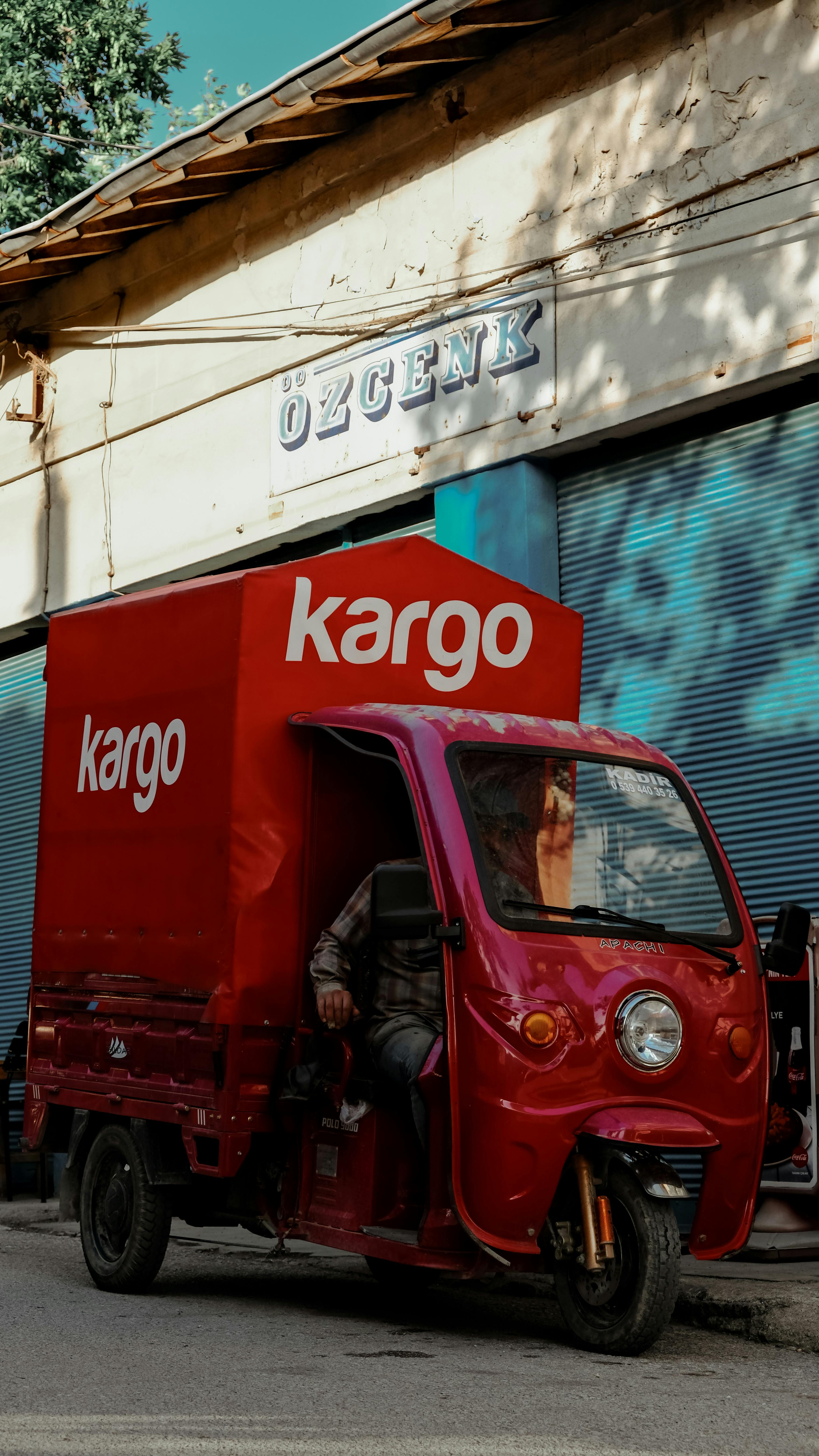 A Red Auto Rickshaw on a Street · Free Stock Photo