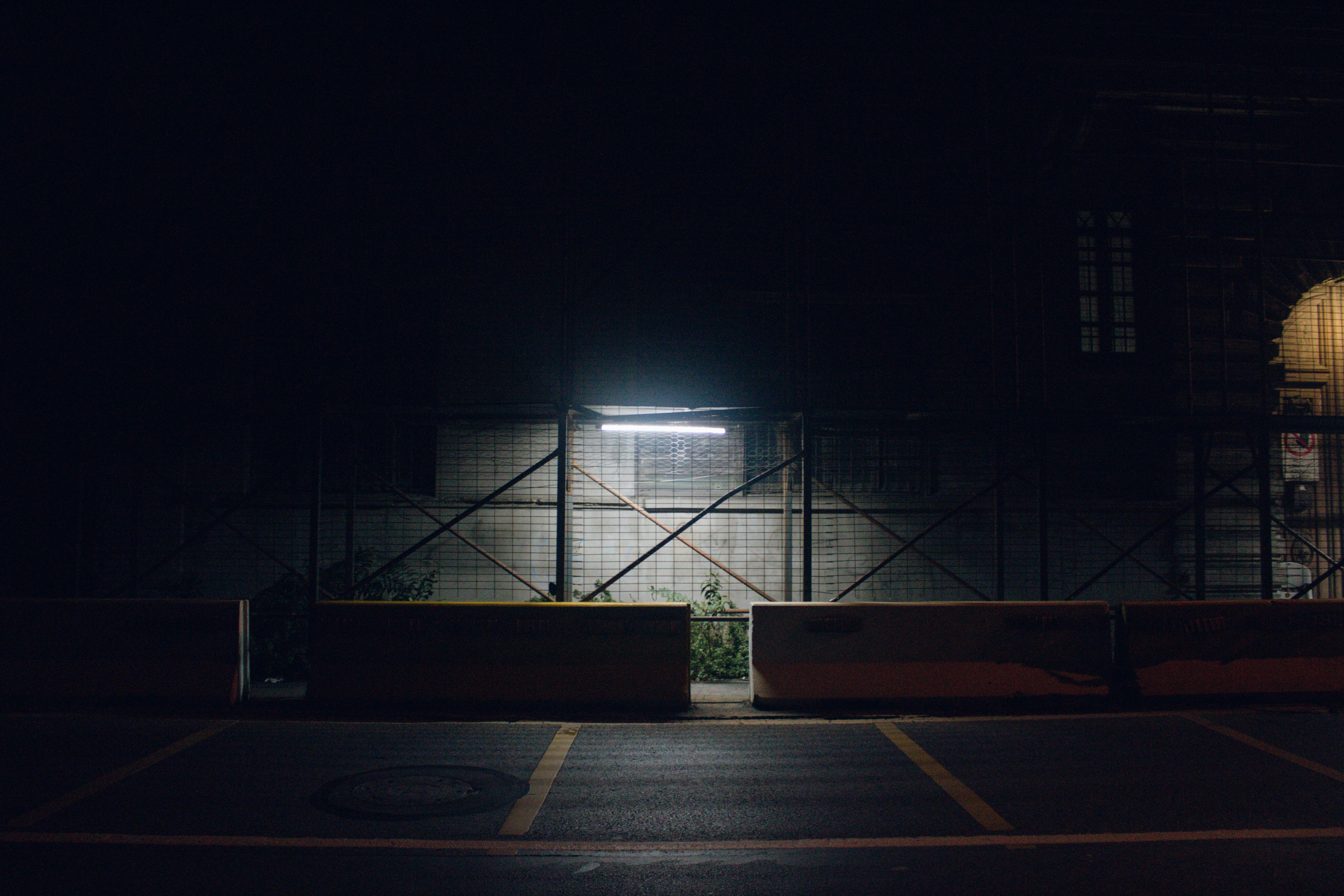 Glowing light in industrial warehouse at night · Free Stock Photo
