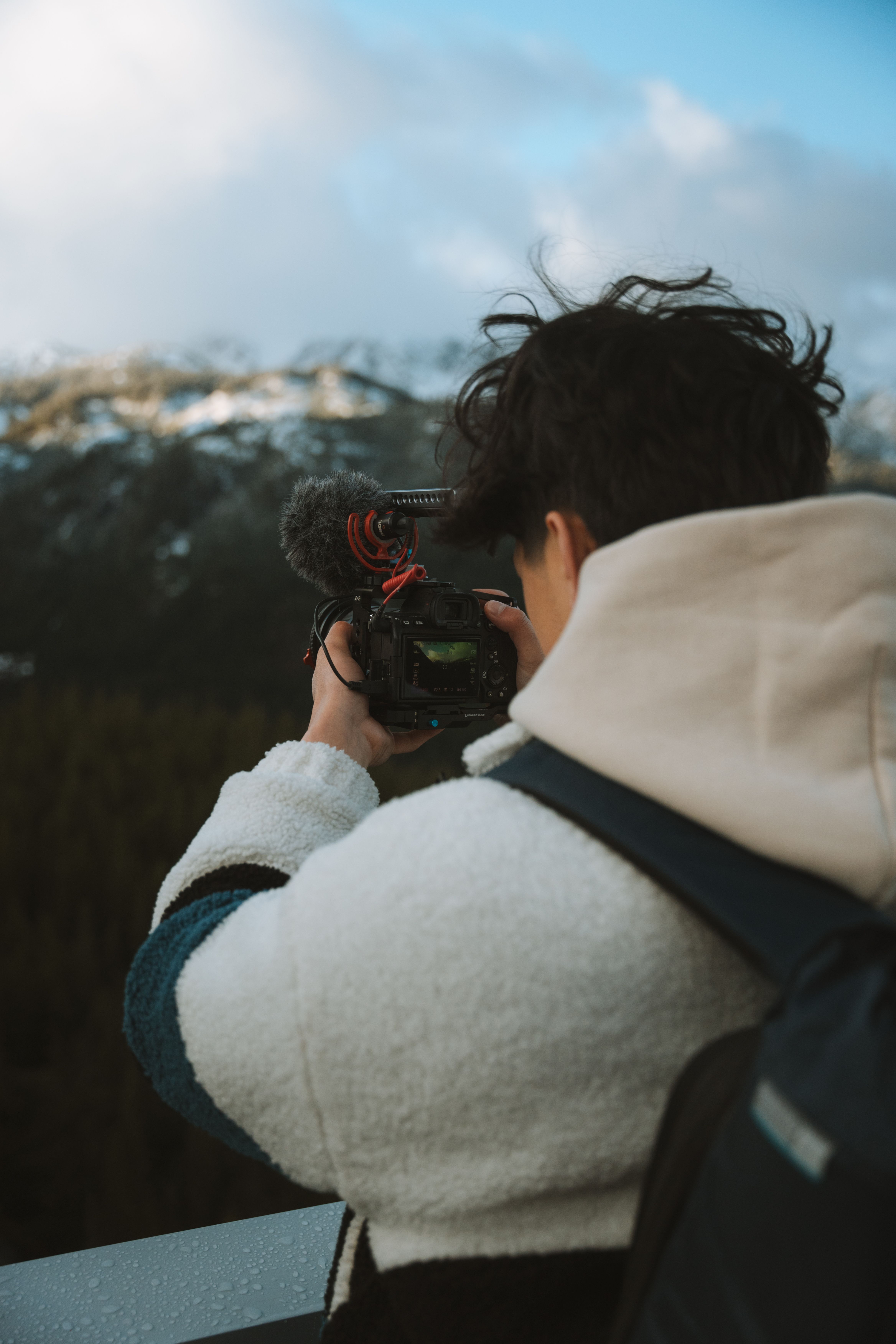 Man Holding Camera and Taking Pictures · Free Stock Photo