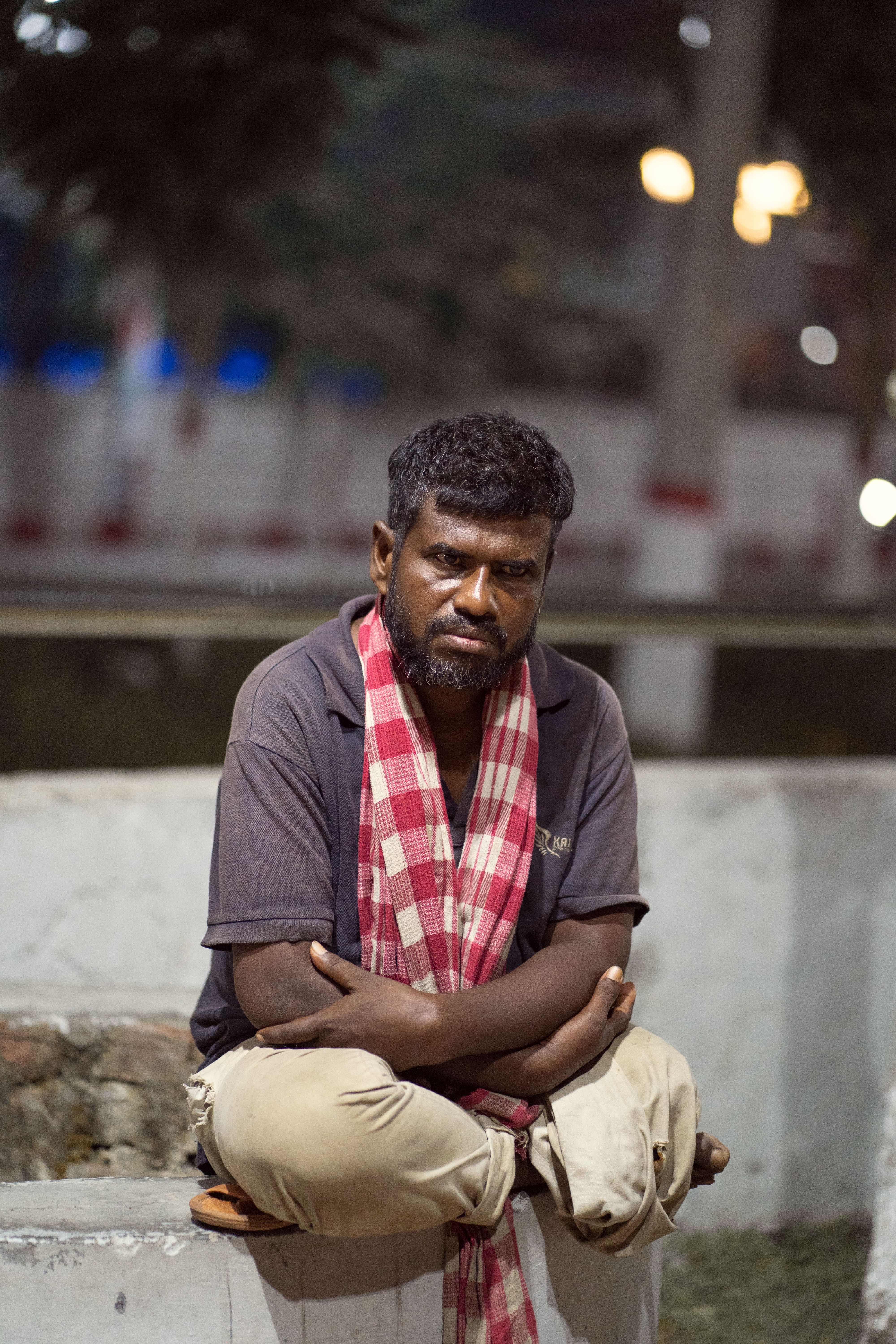A Man Sitting in a City · Free Stock Photo