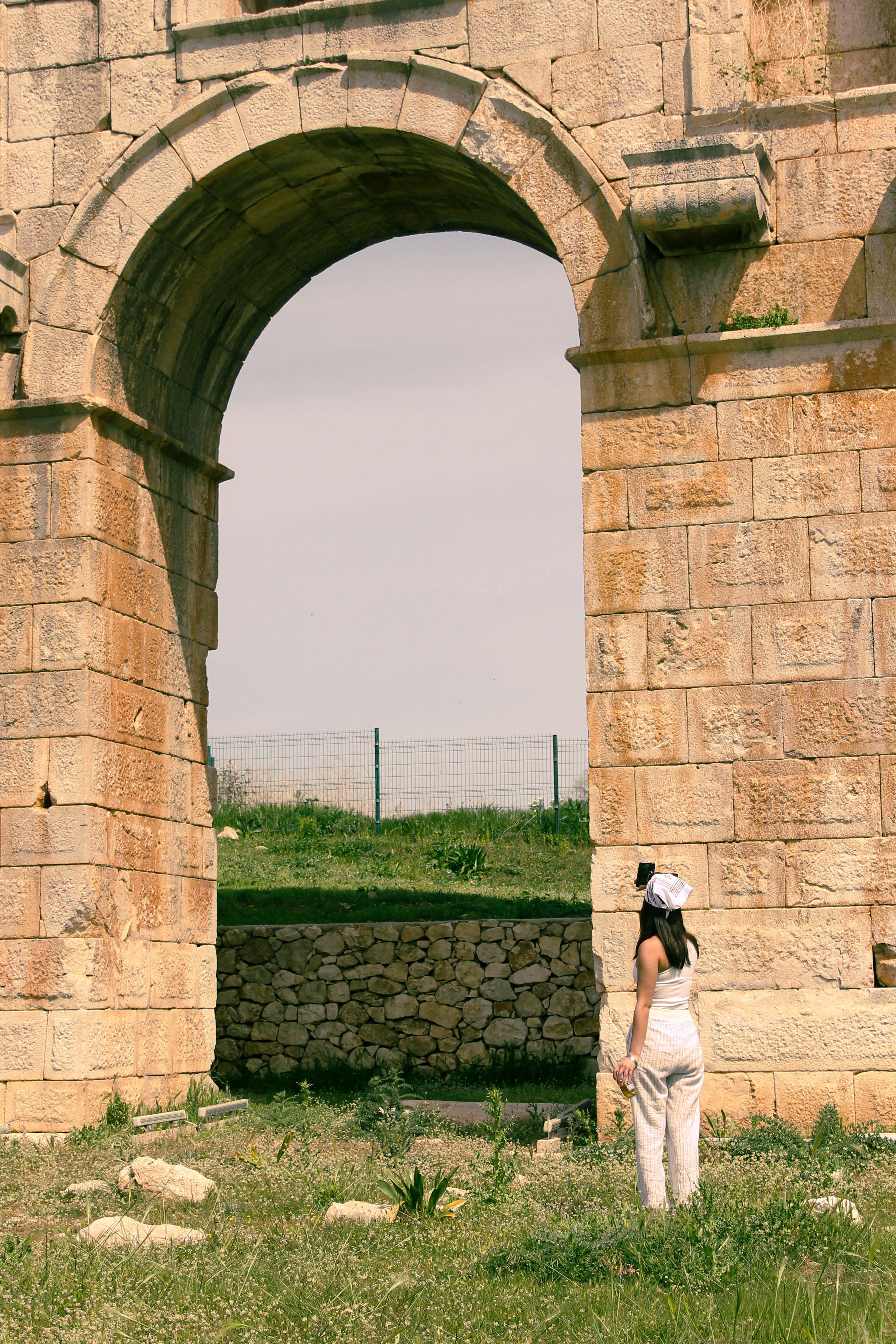 Woman Taking Pictures of Ancient Building Arch · Free Stock Photo