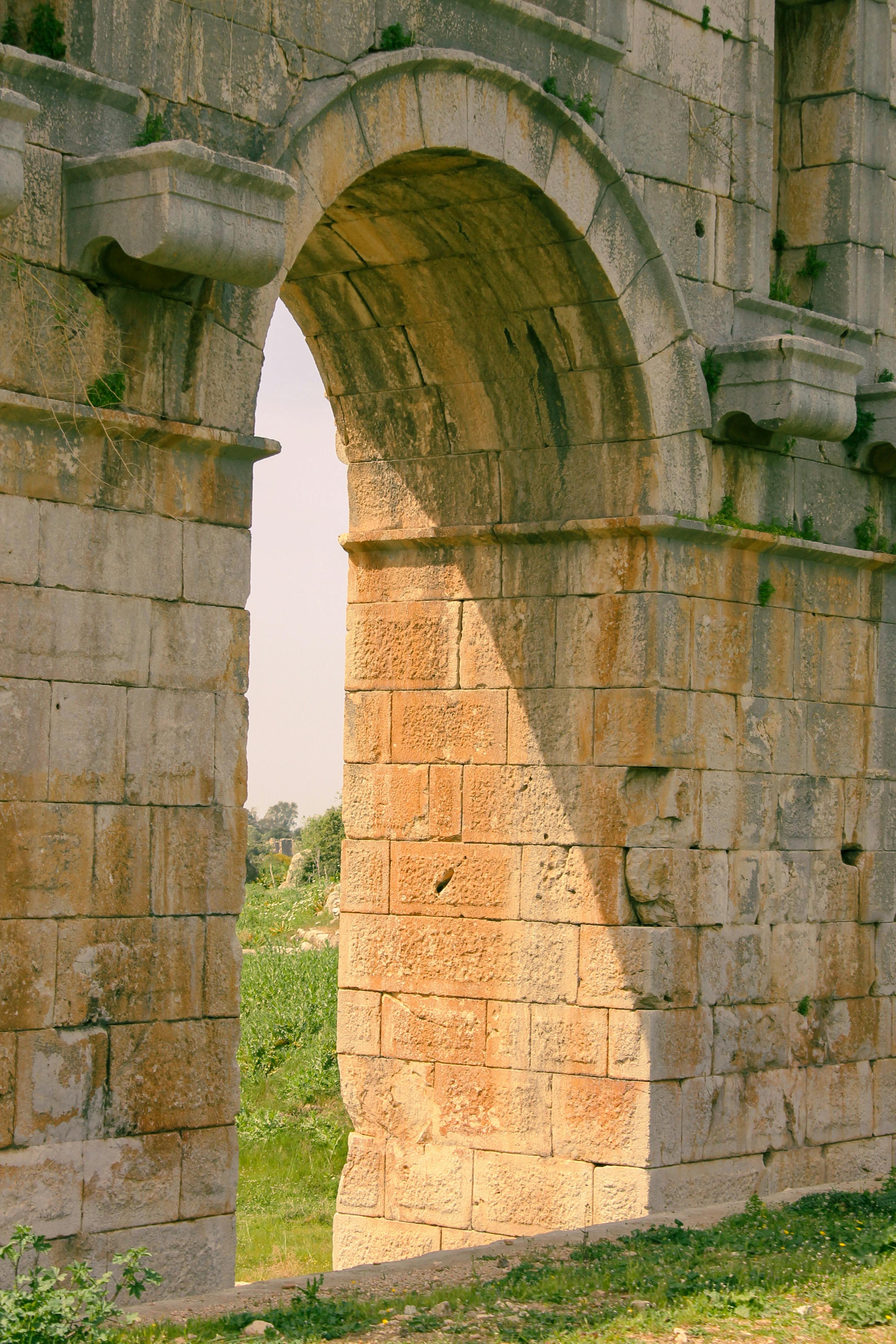 Man Standing in Front of an Arch in a Fortress · Free Stock Photo