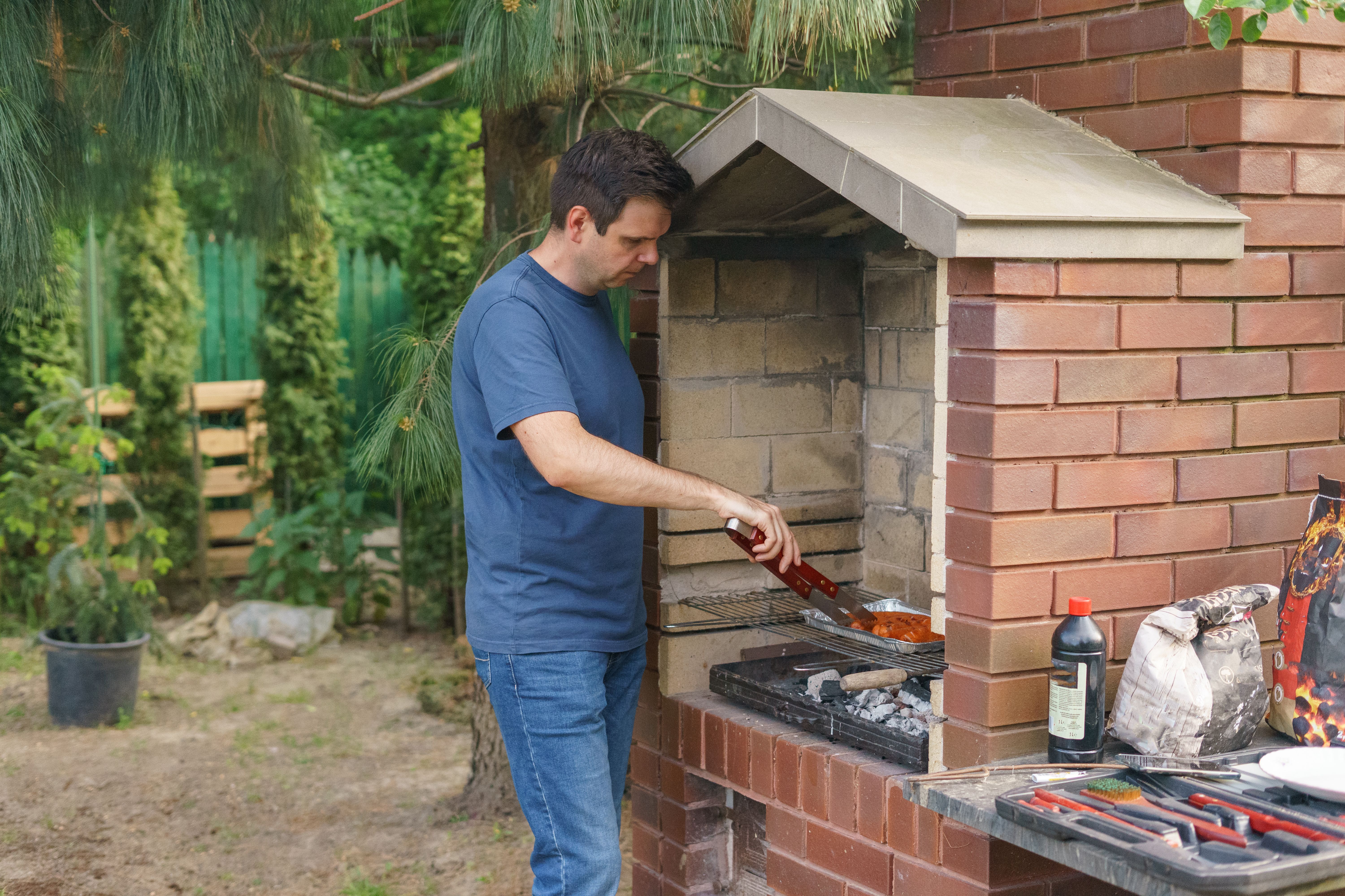 A Man with a Barbecue Grill · Free Stock Photo