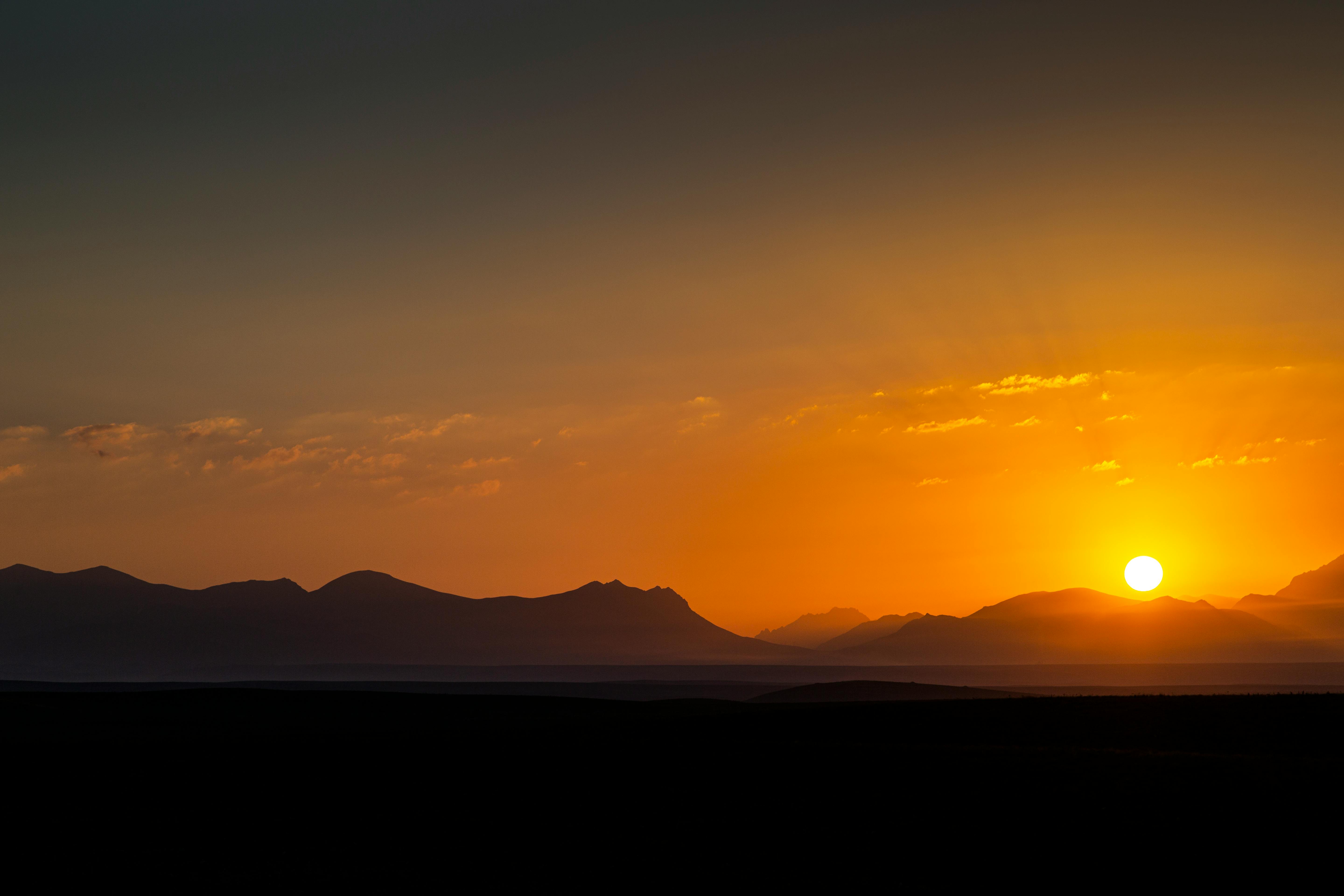 Sunset over the Landscape of Mountains · Free Stock Photo