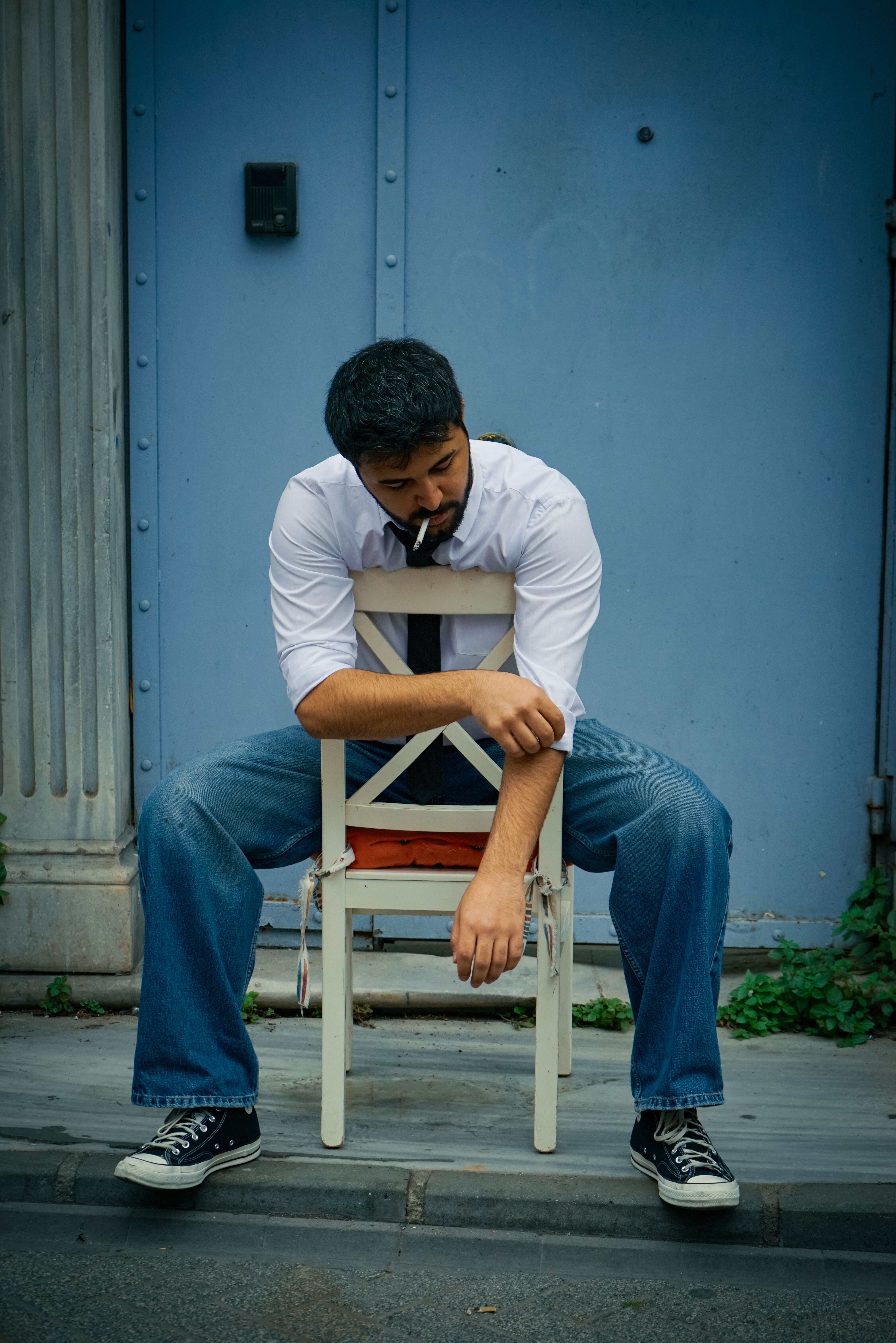 Man in Jeans Smoking Cigarette · Free Stock Photo