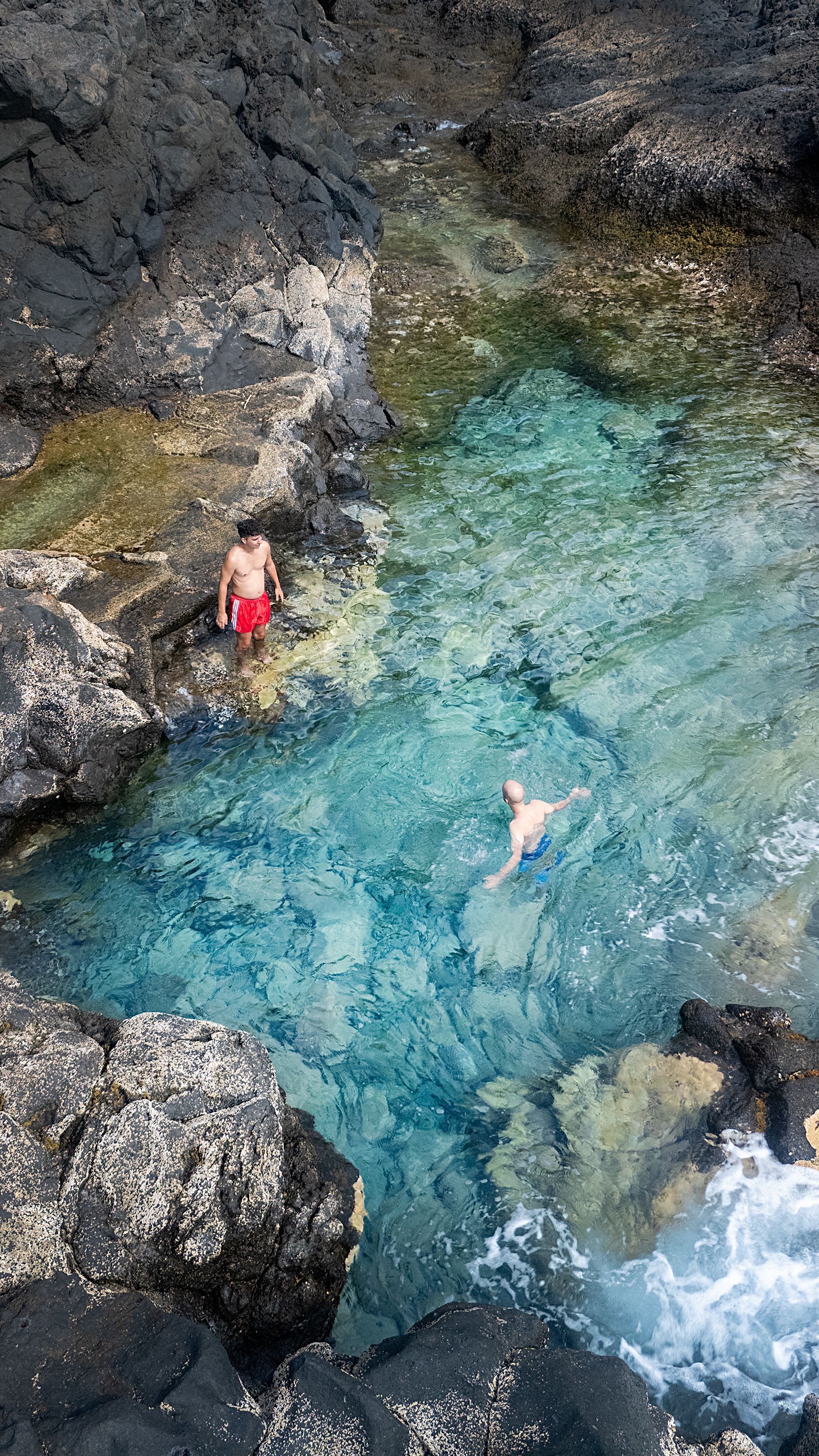 Men Bathing in Rocky Bay · Free Stock Photo