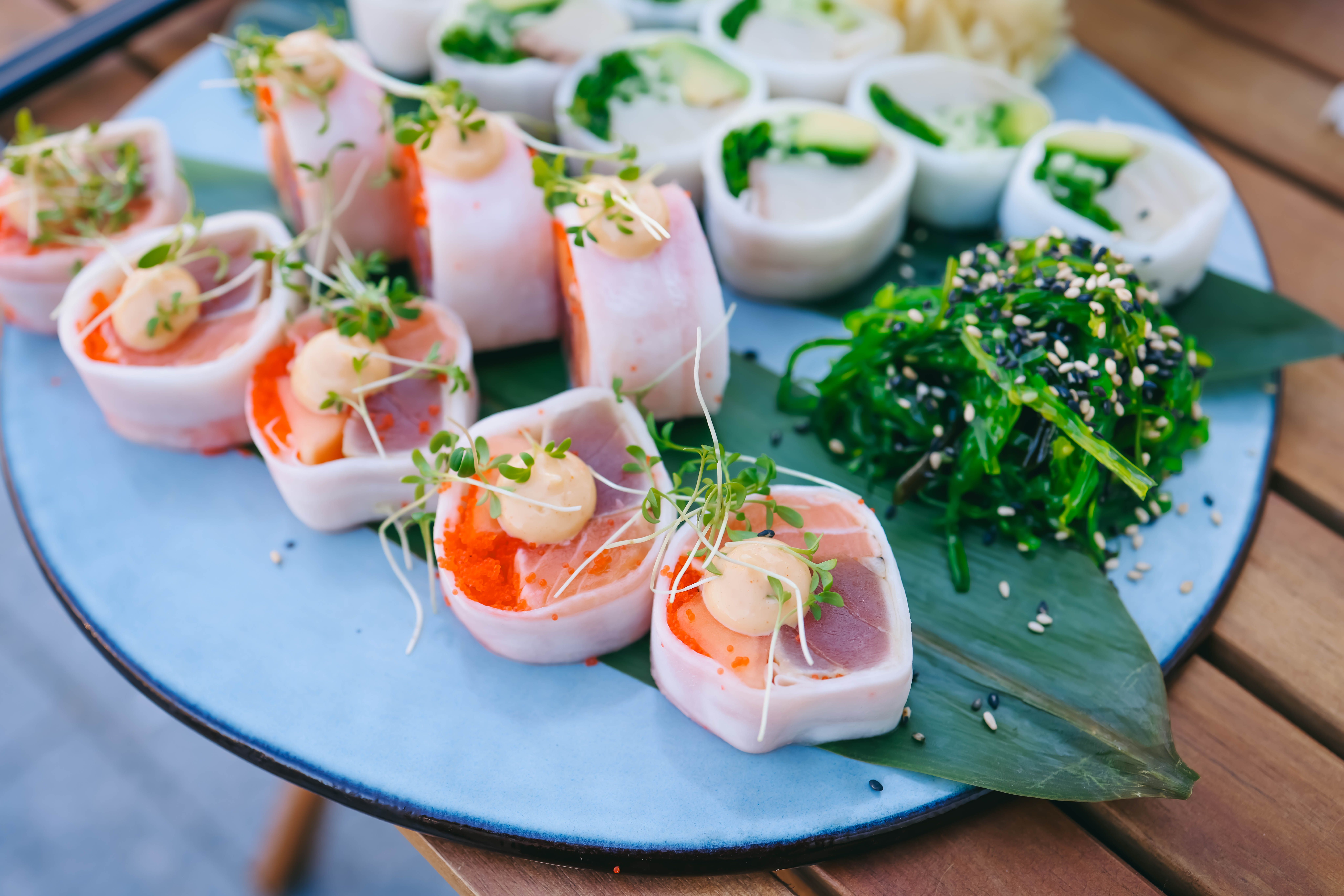 Close-up of Sashimi Rolls on a Blue Plate · Free Stock Photo
