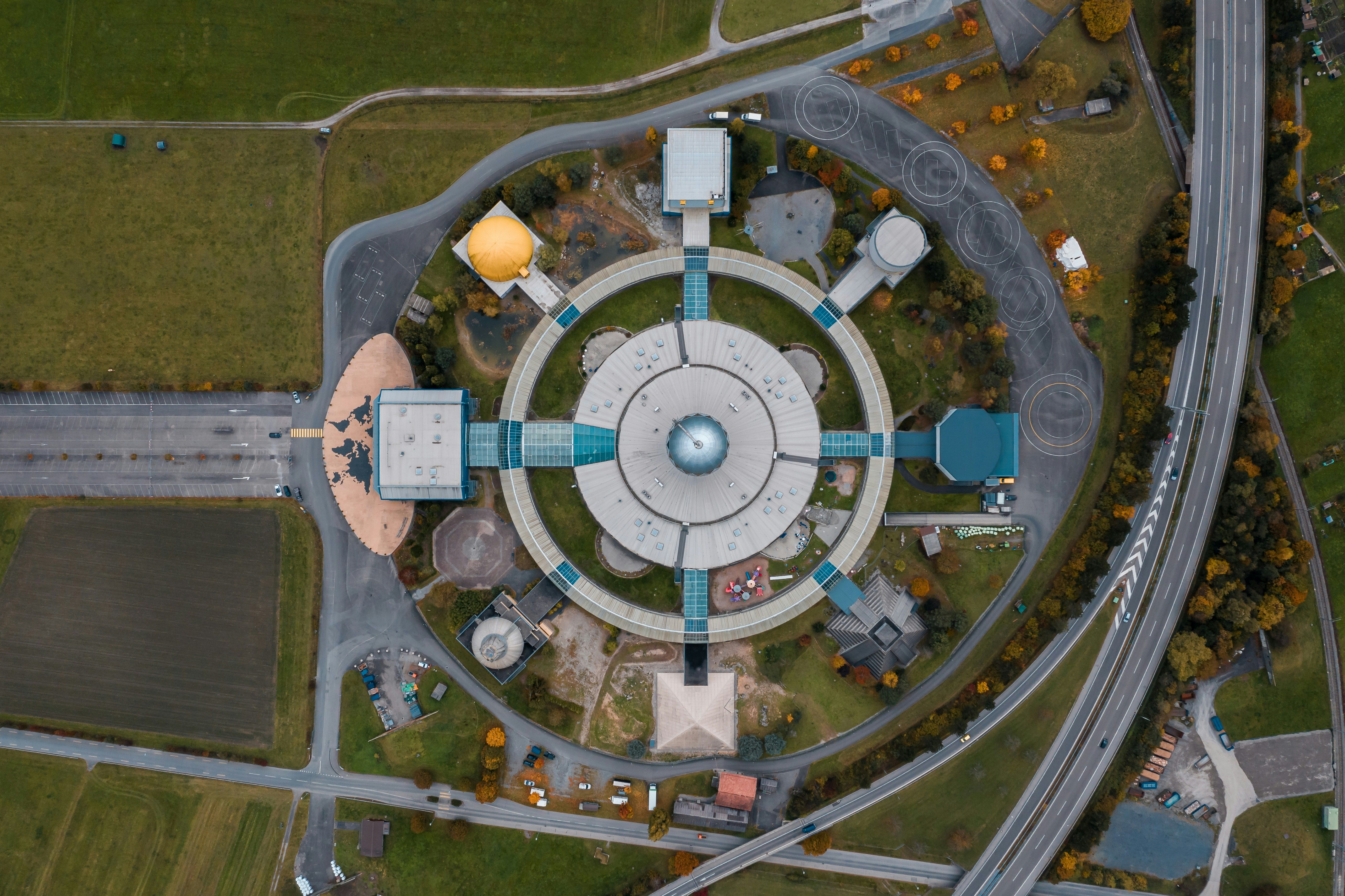 Aerial view of a circular building with a large circular structure ...