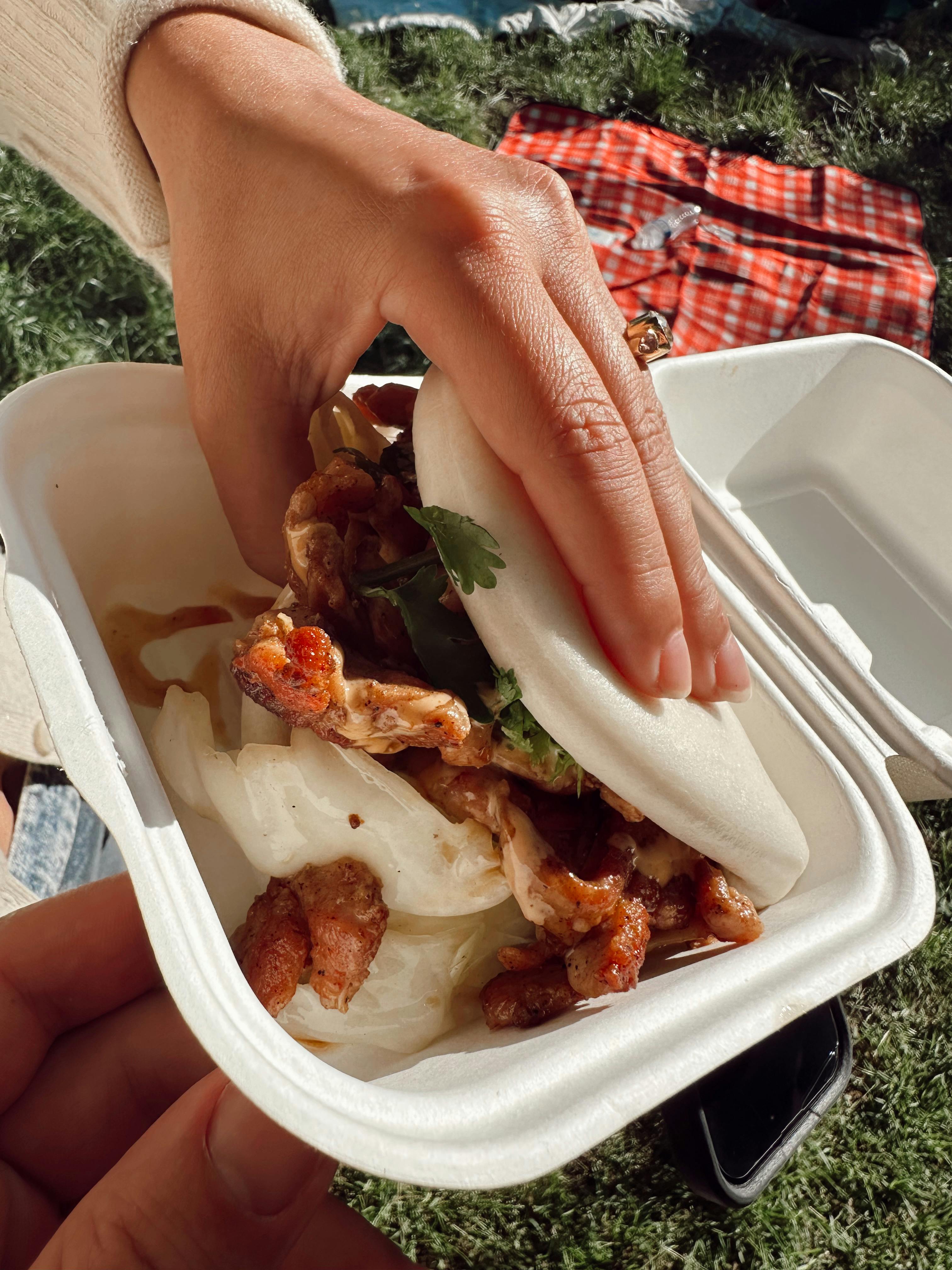 Eating Bao Bun with Fried Chicken · Free Stock Photo