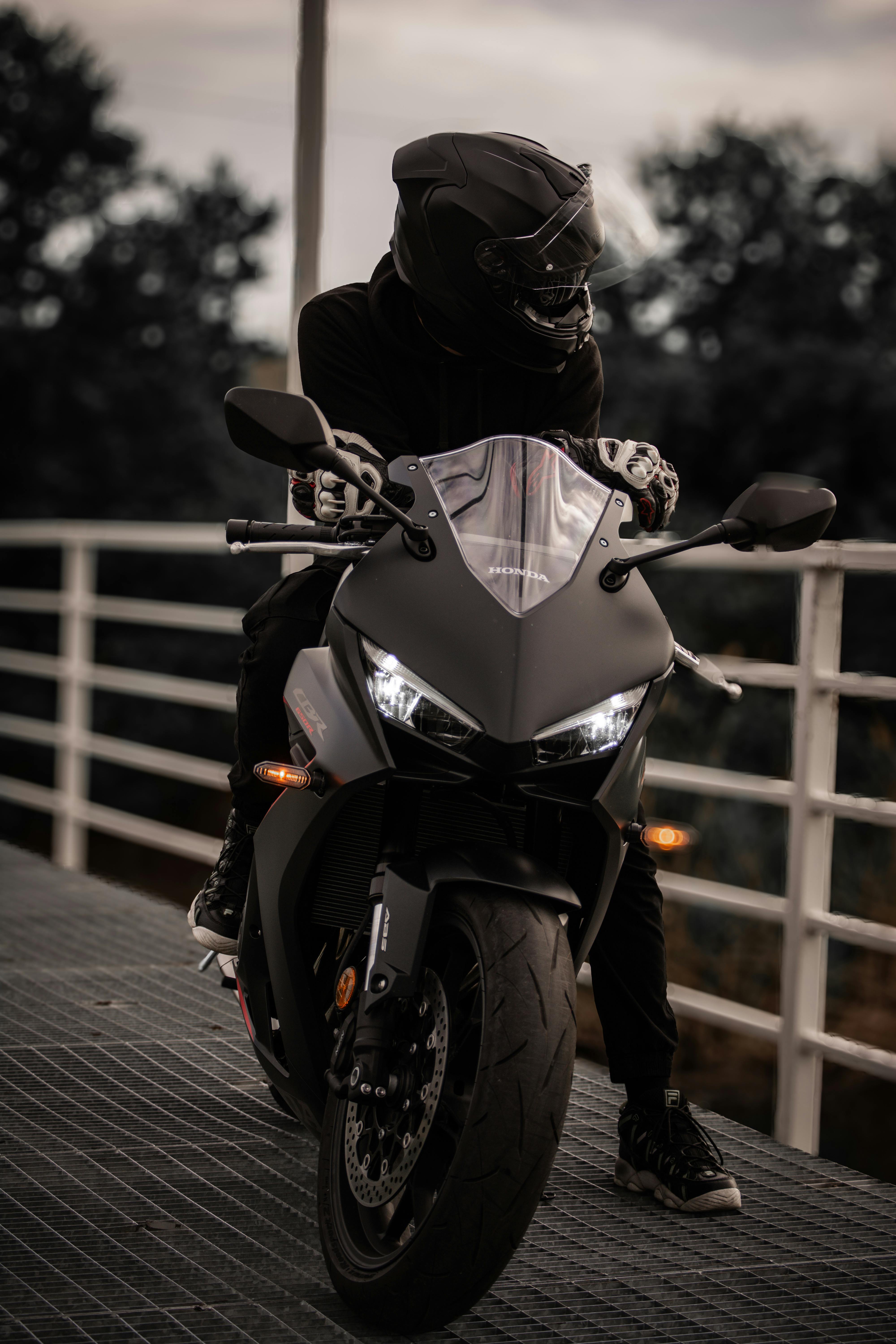 Rider in Black on Black Sports Motorcycle · Free Stock Photo