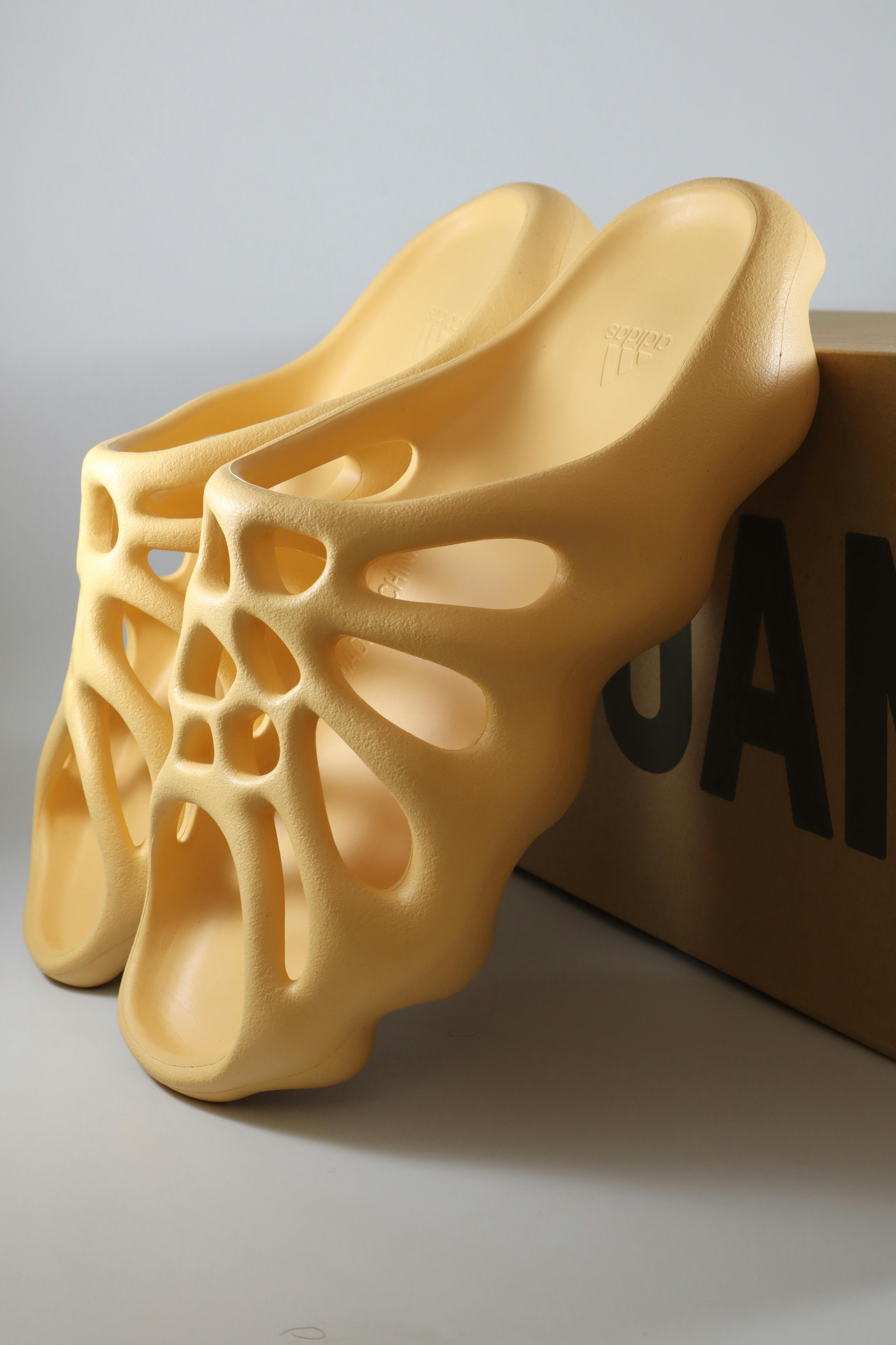 A Pair of Adidas Yeezy 450 Slides · Free Stock Photo