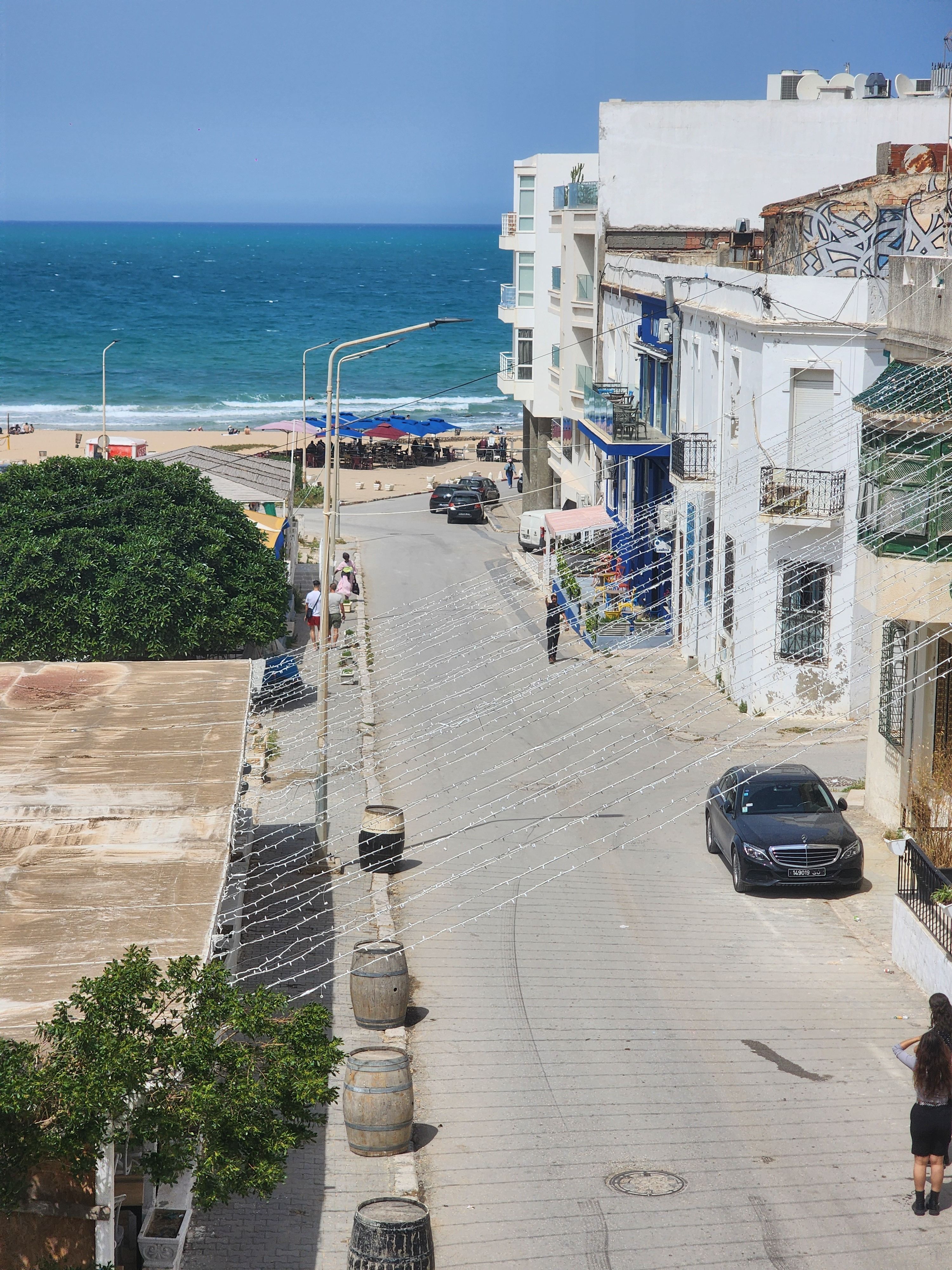Road in Seaside Village with Buildings and Lights over Street · Free ...