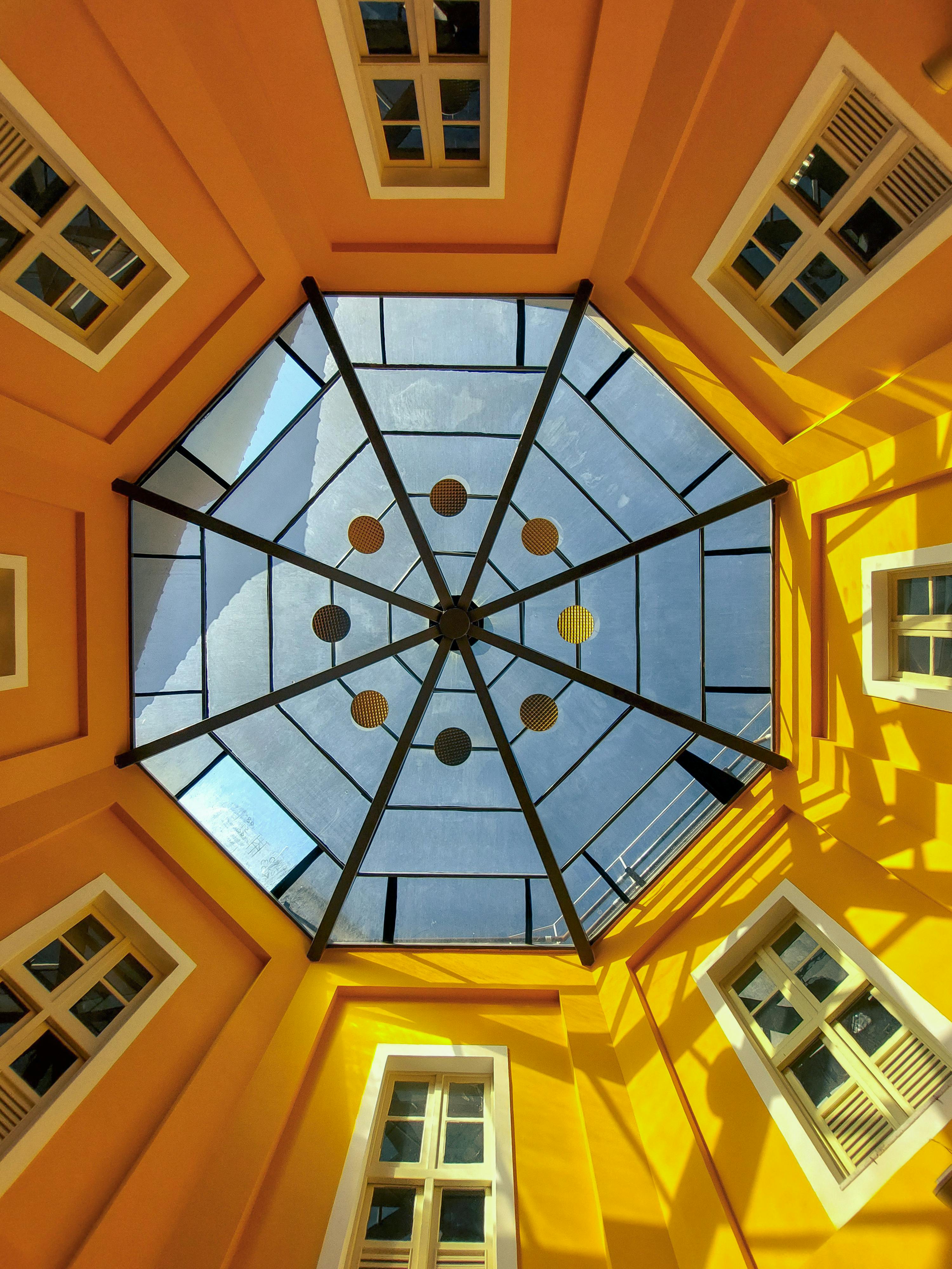 Yellow Octagonal Room with Glass Ceiling and Windows · Free Stock Photo
