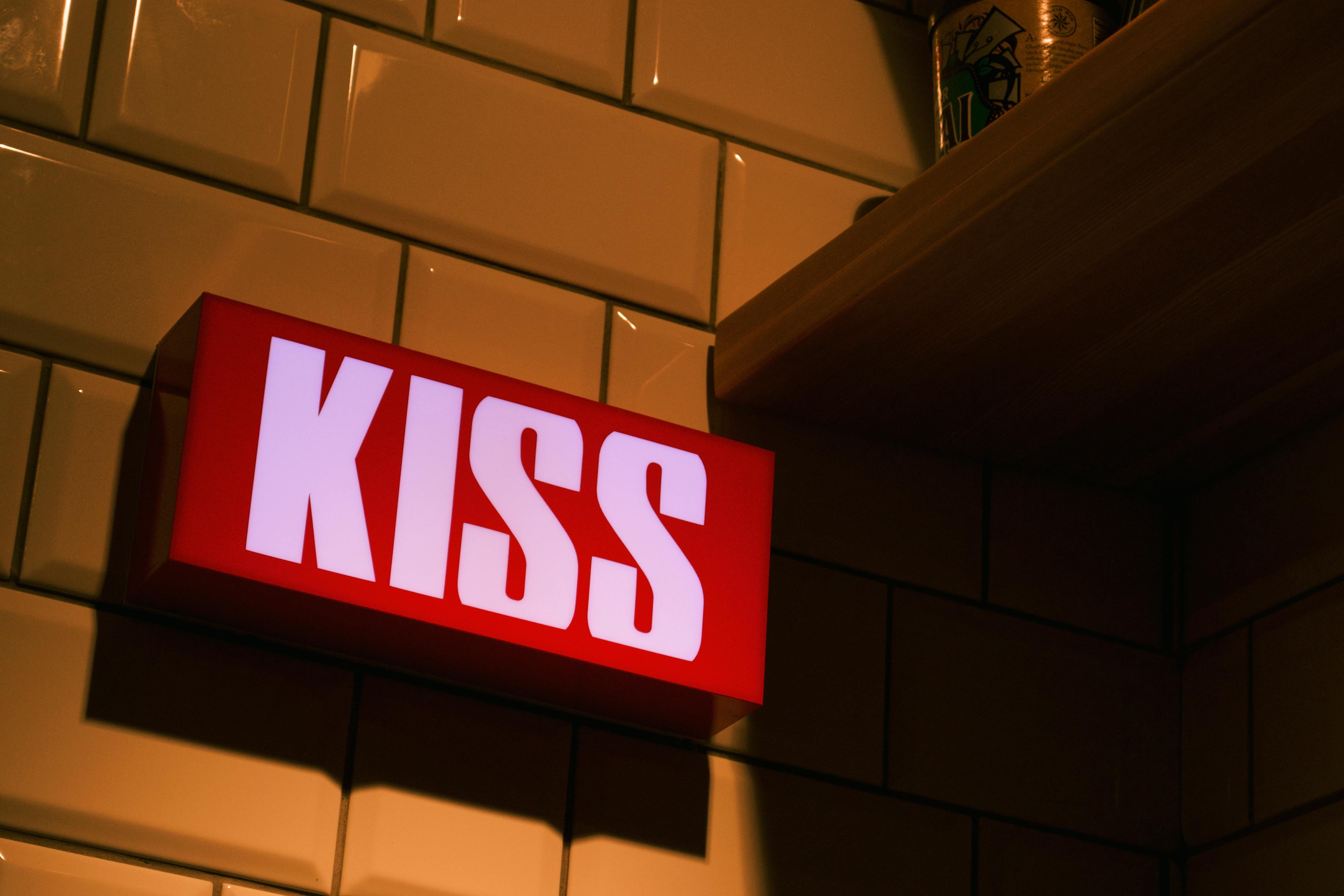 Photo of Kiss Signage on Wall · Free Stock Photo