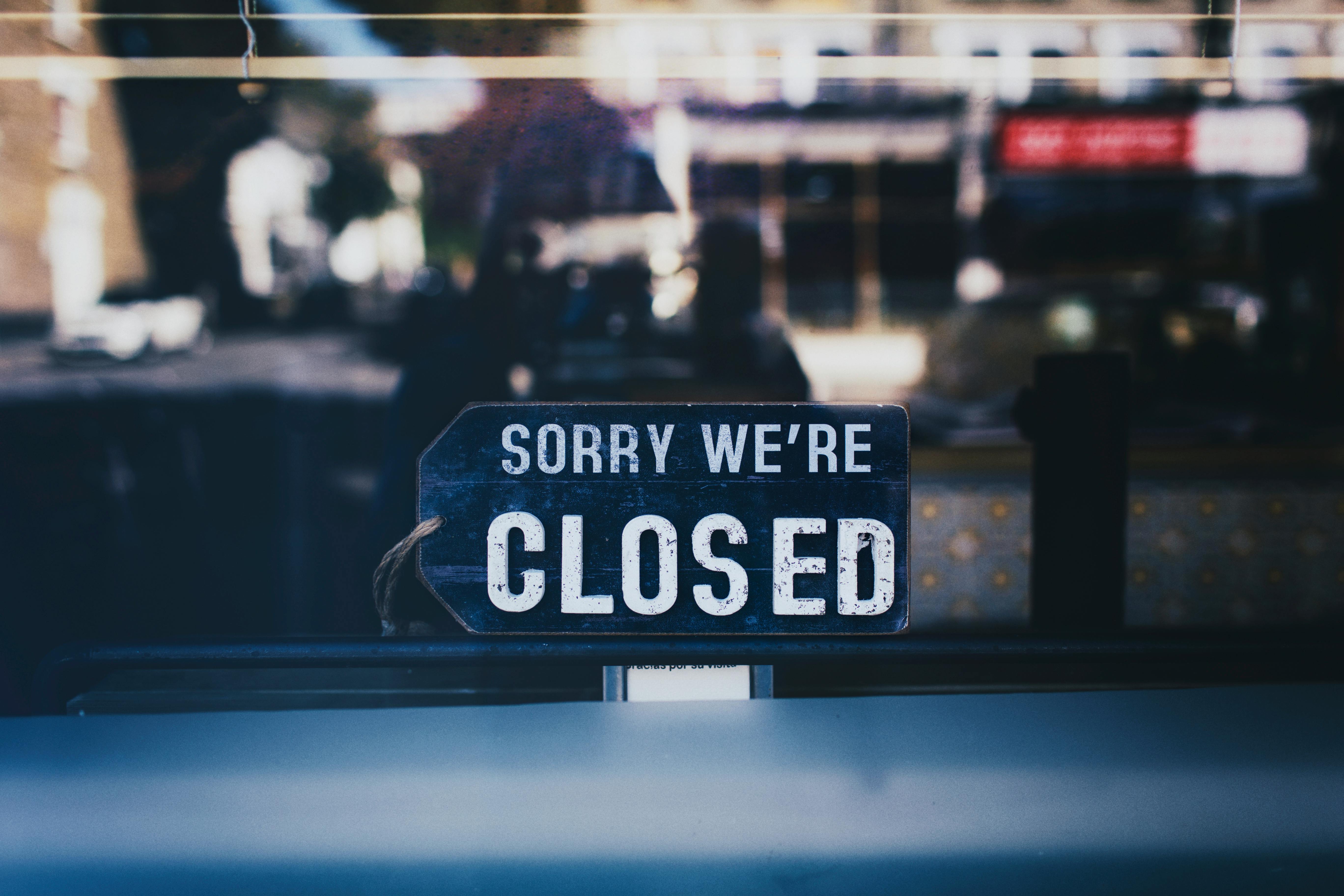 Close-Up Photo of Sorry We're Closed Sign on Glass Window · Free Stock ...